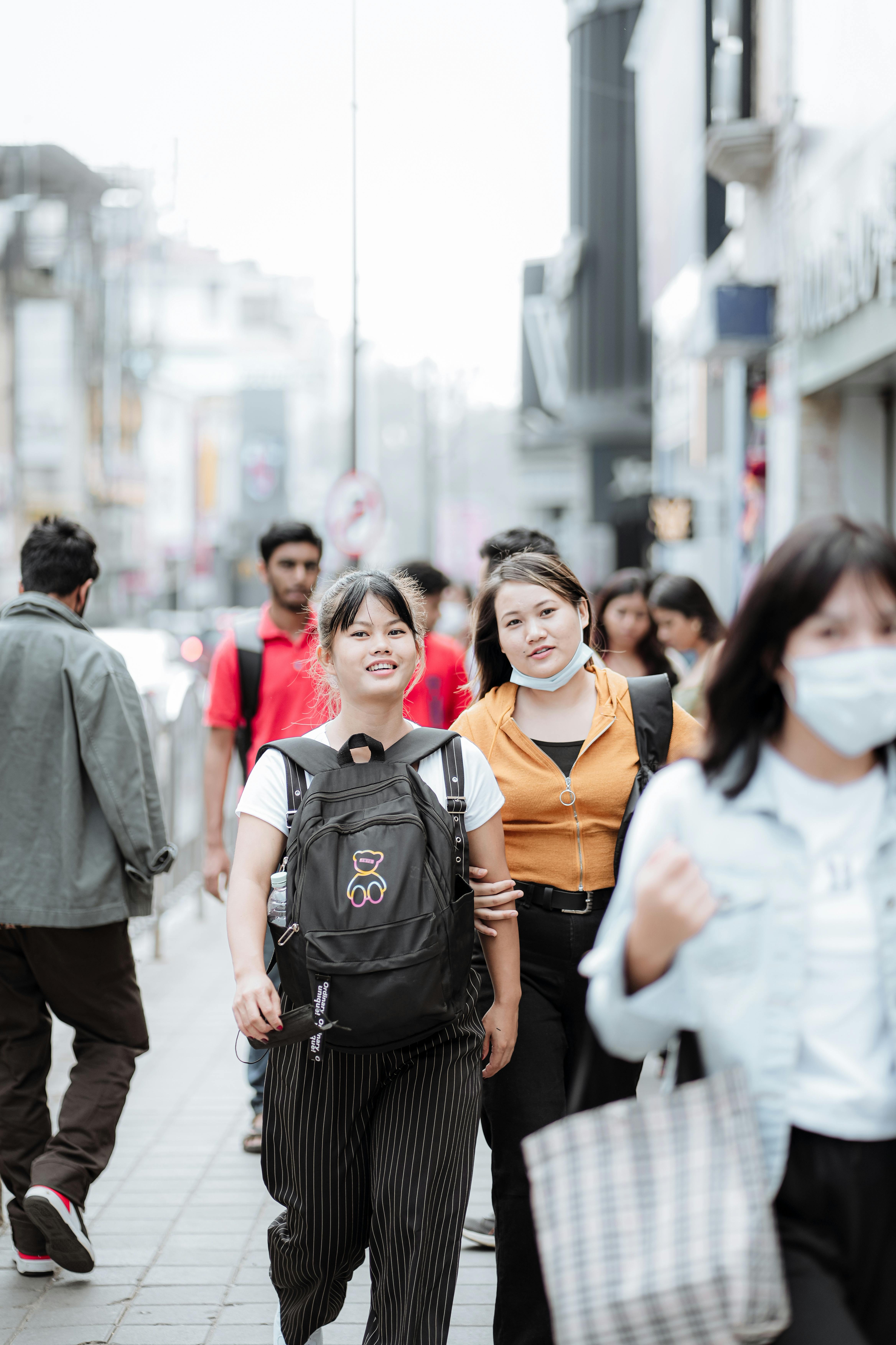People Falling in Line on the Entrance · Free Stock Photo
