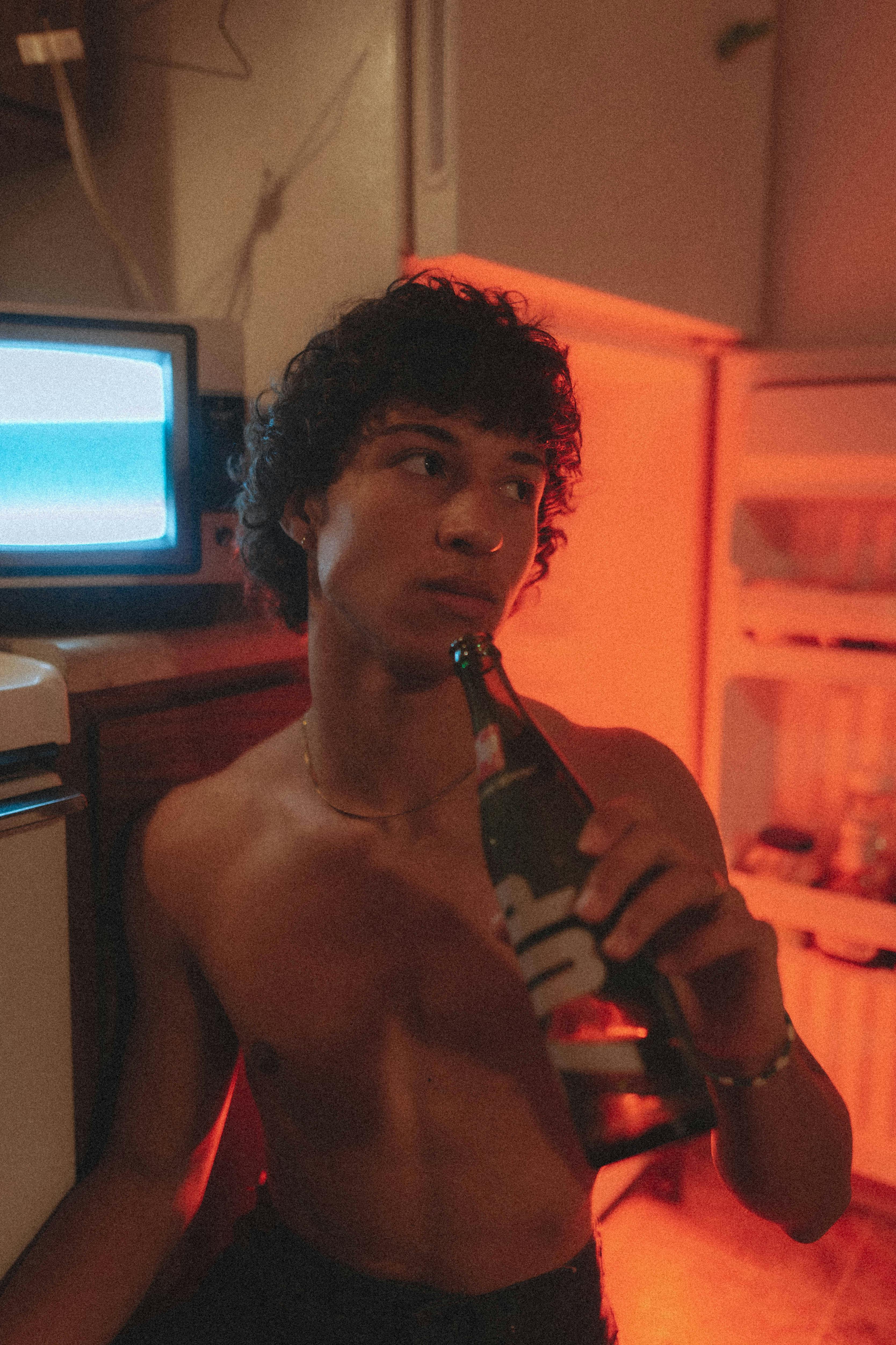 A Shirtless Man Drinking Soda · Free Stock Photo