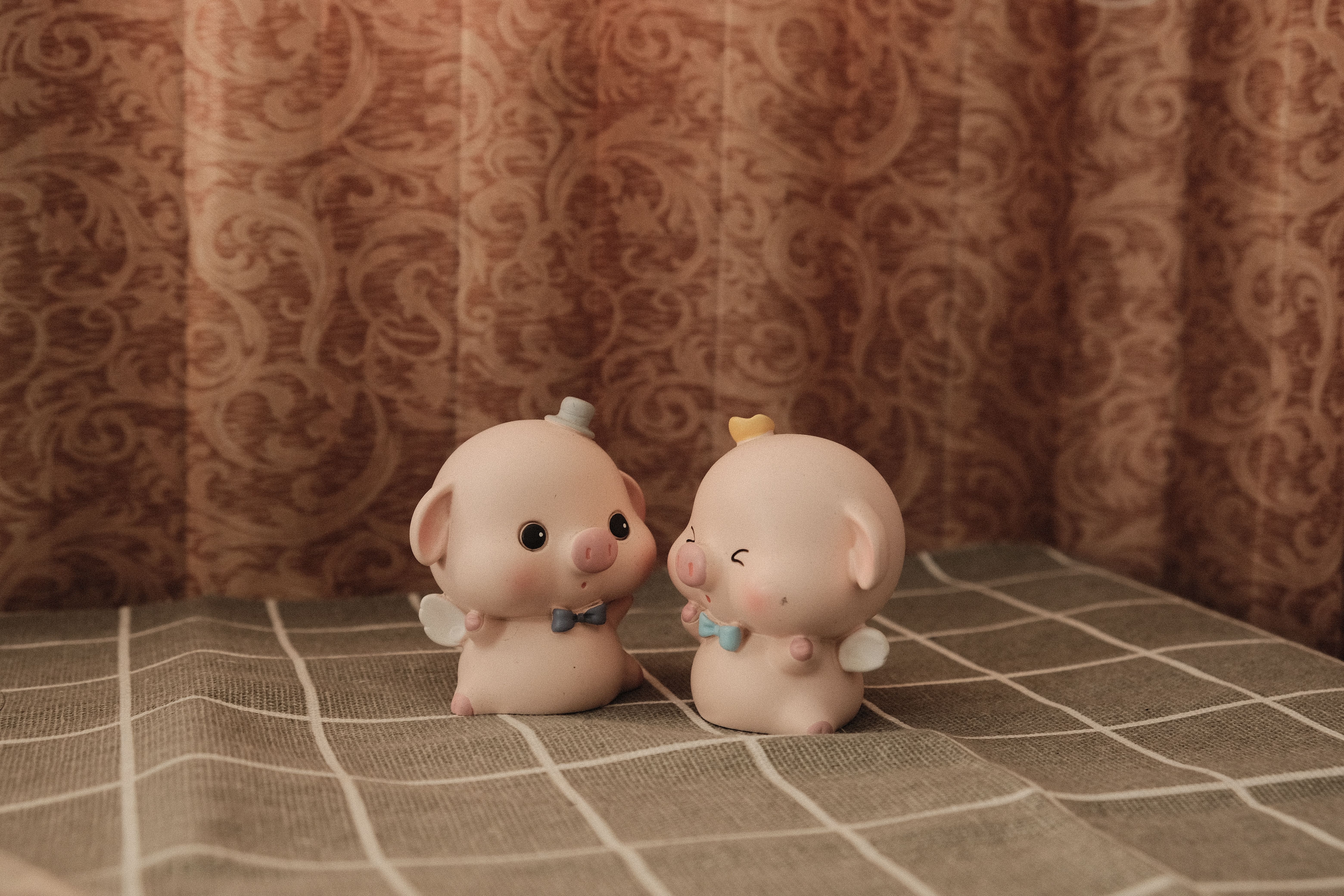 Piggy Dolls over Brown Cloth · Free Stock Photo
