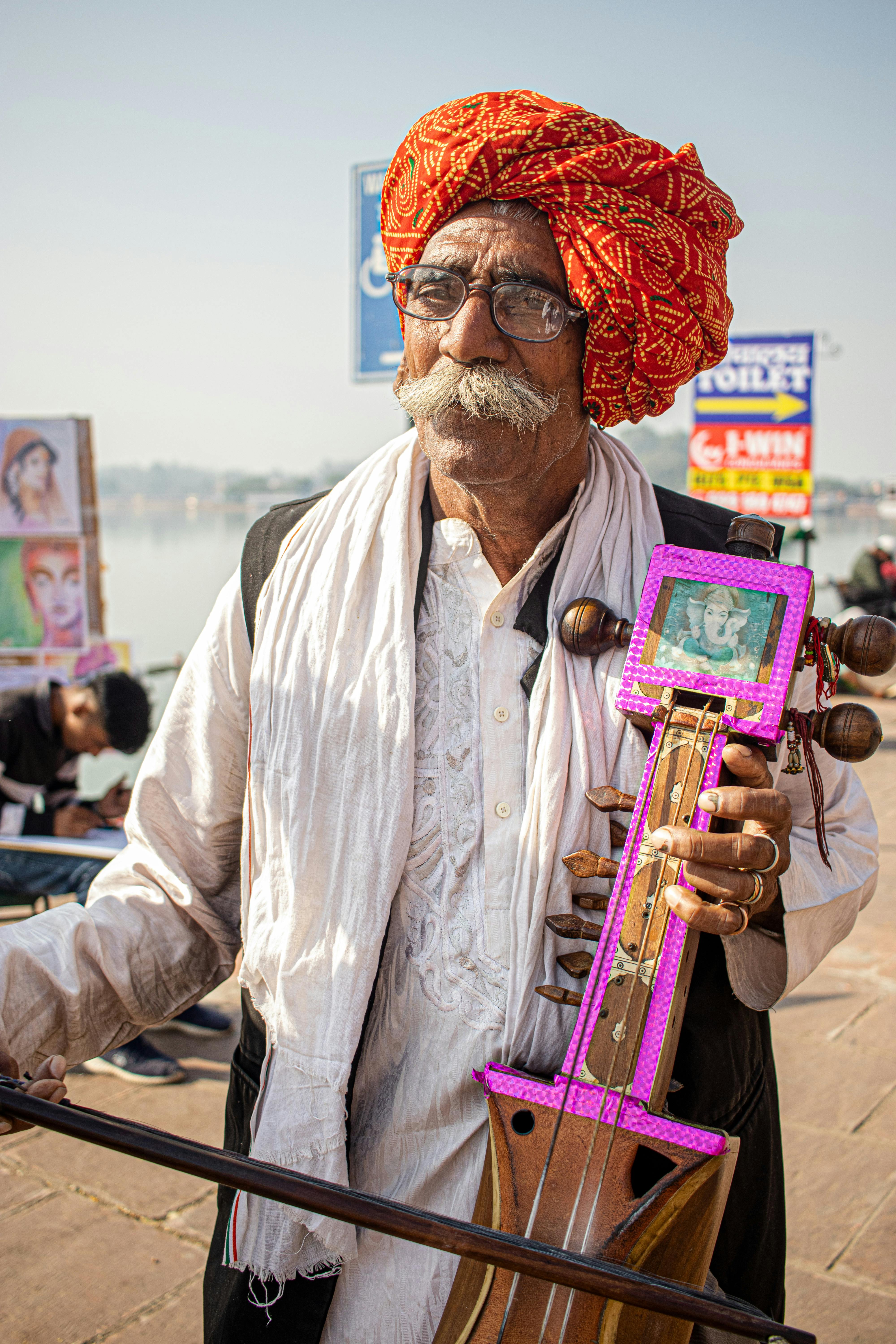 Man with Mustache Holding Musical Instrument in Hand · Free Stock Photo