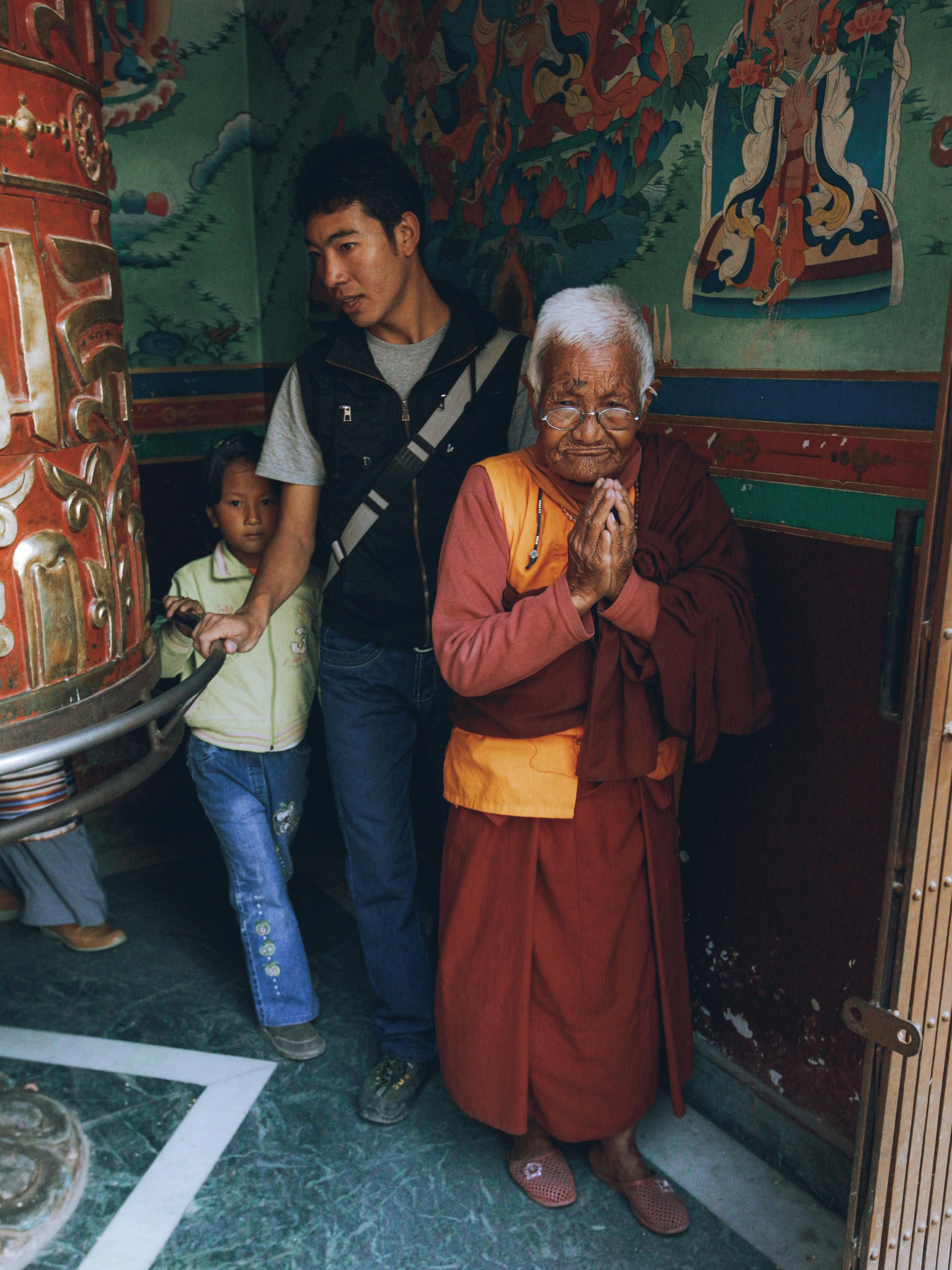 Man and Kid with Monk in Monastery · Free Stock Photo