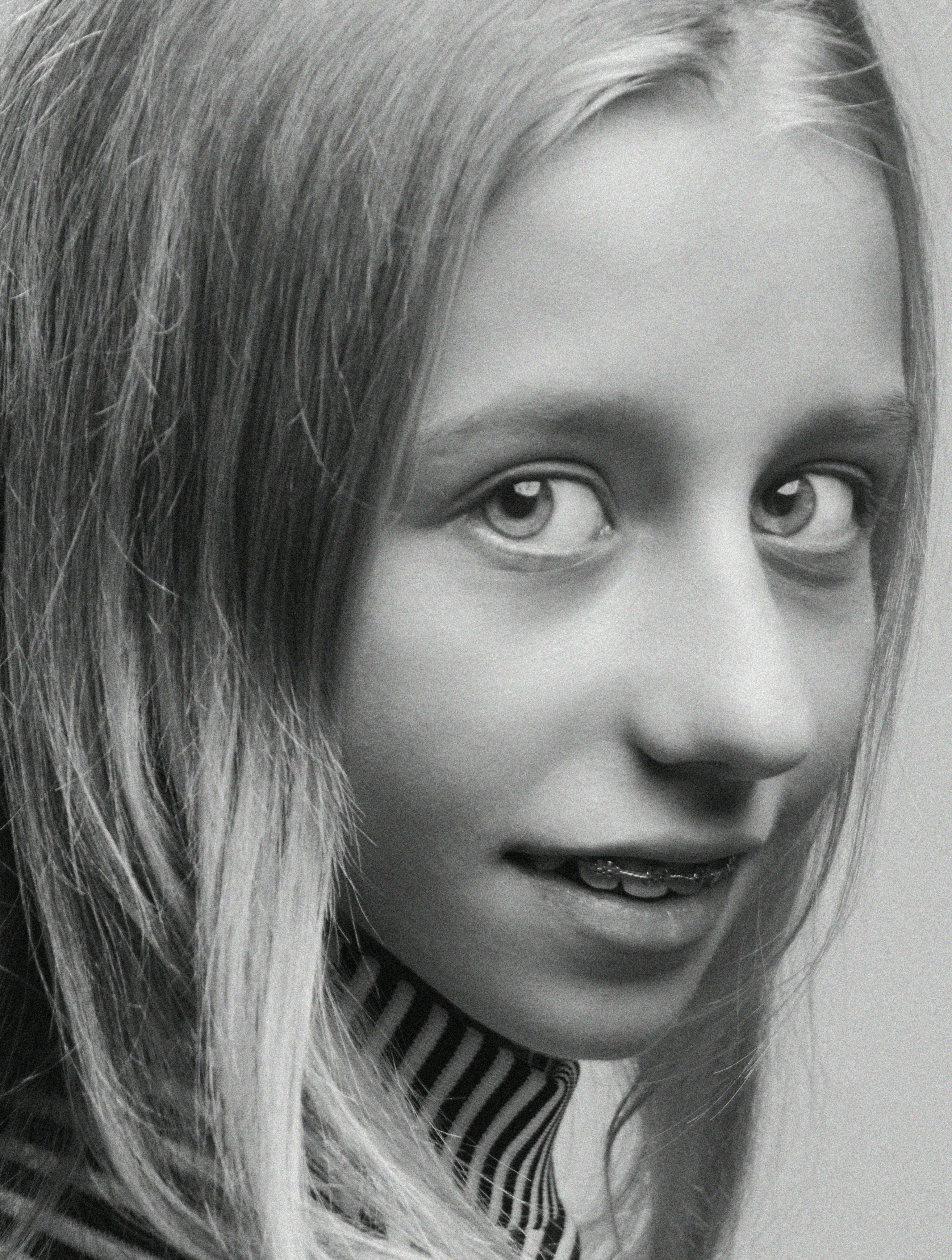 Grayscale Portrait of a Girl With Braces · Free Stock Photo