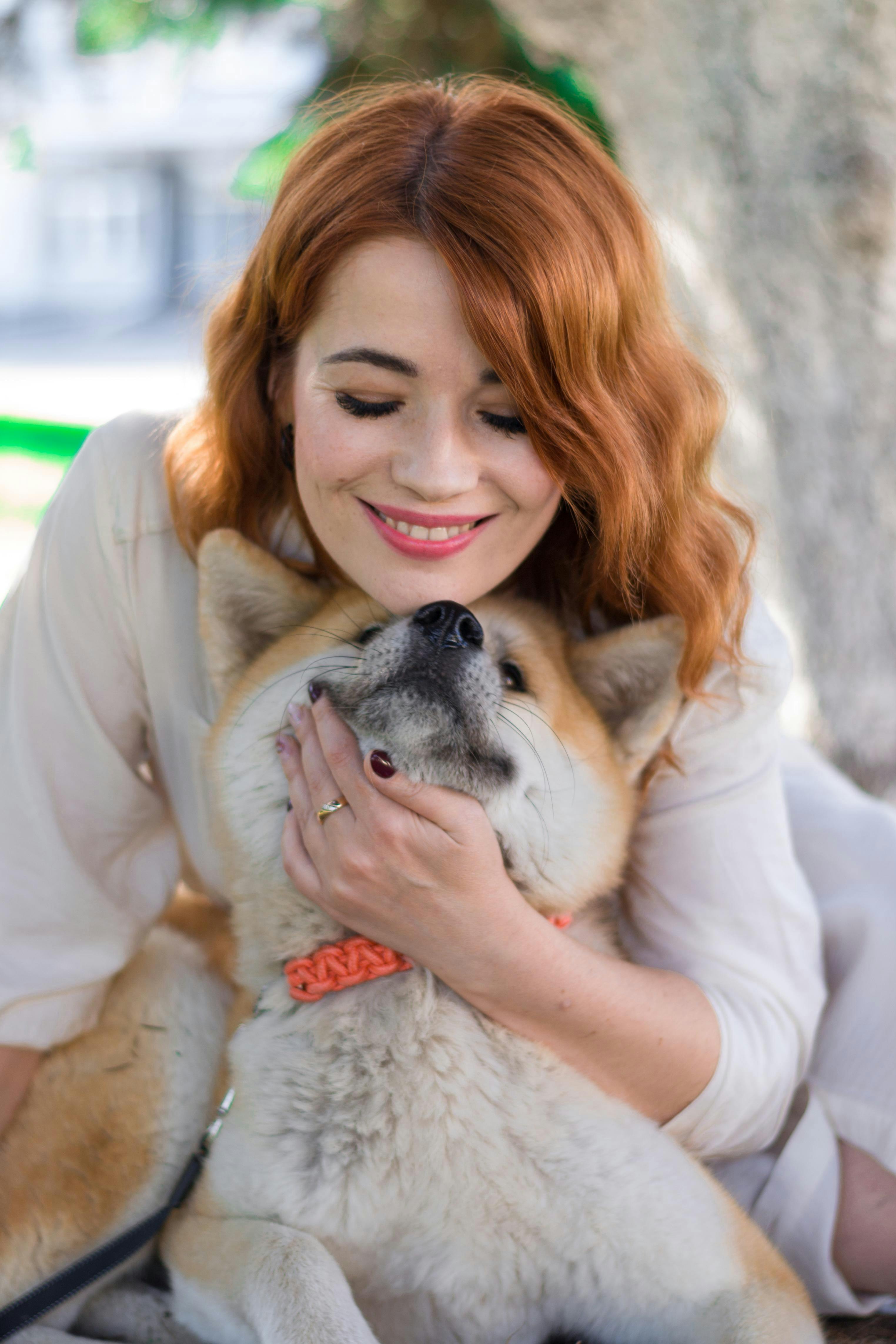A Dog Getting A Hug From A Woman · Free Stock Photo