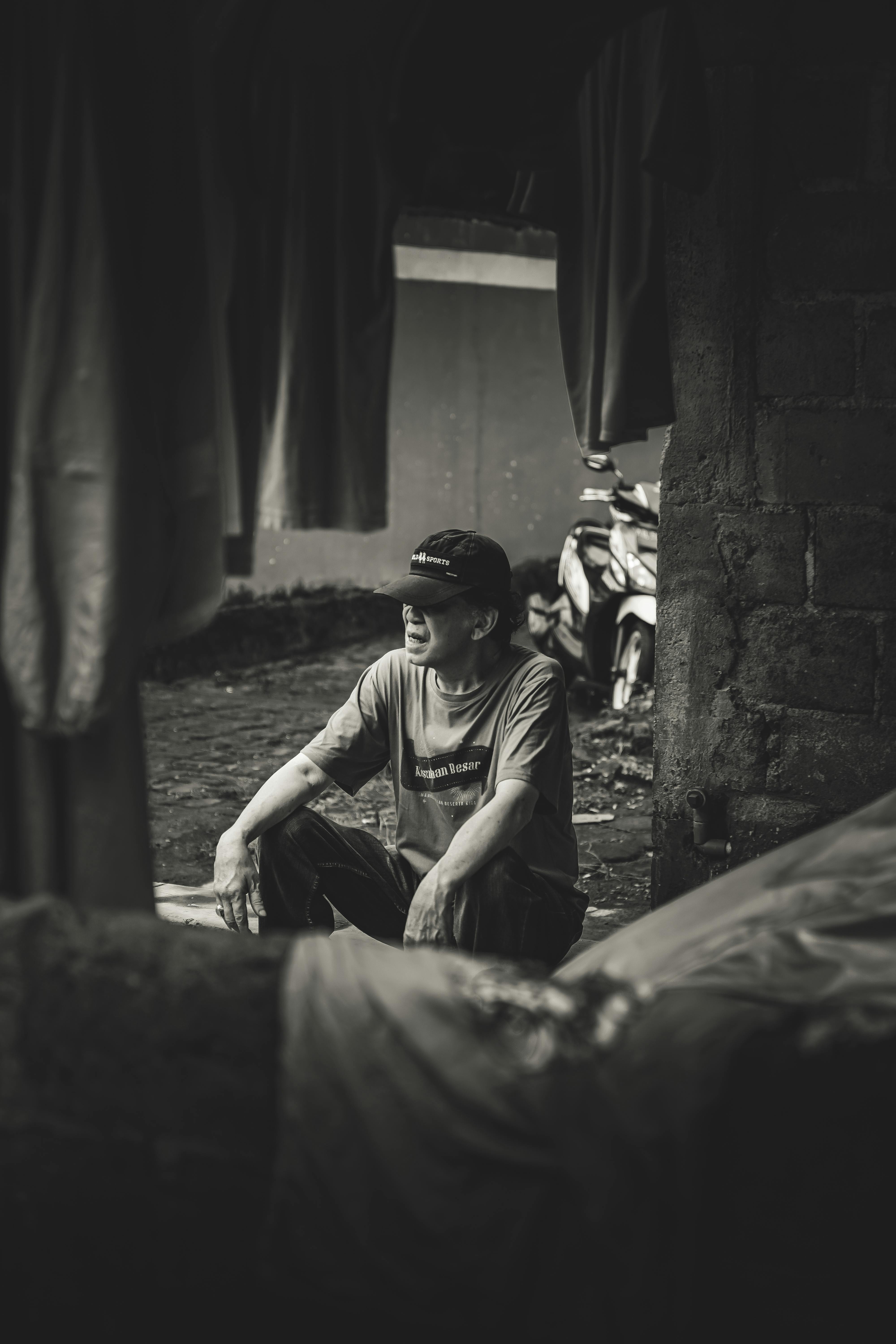 A Man Sitting Outside · Free Stock Photo