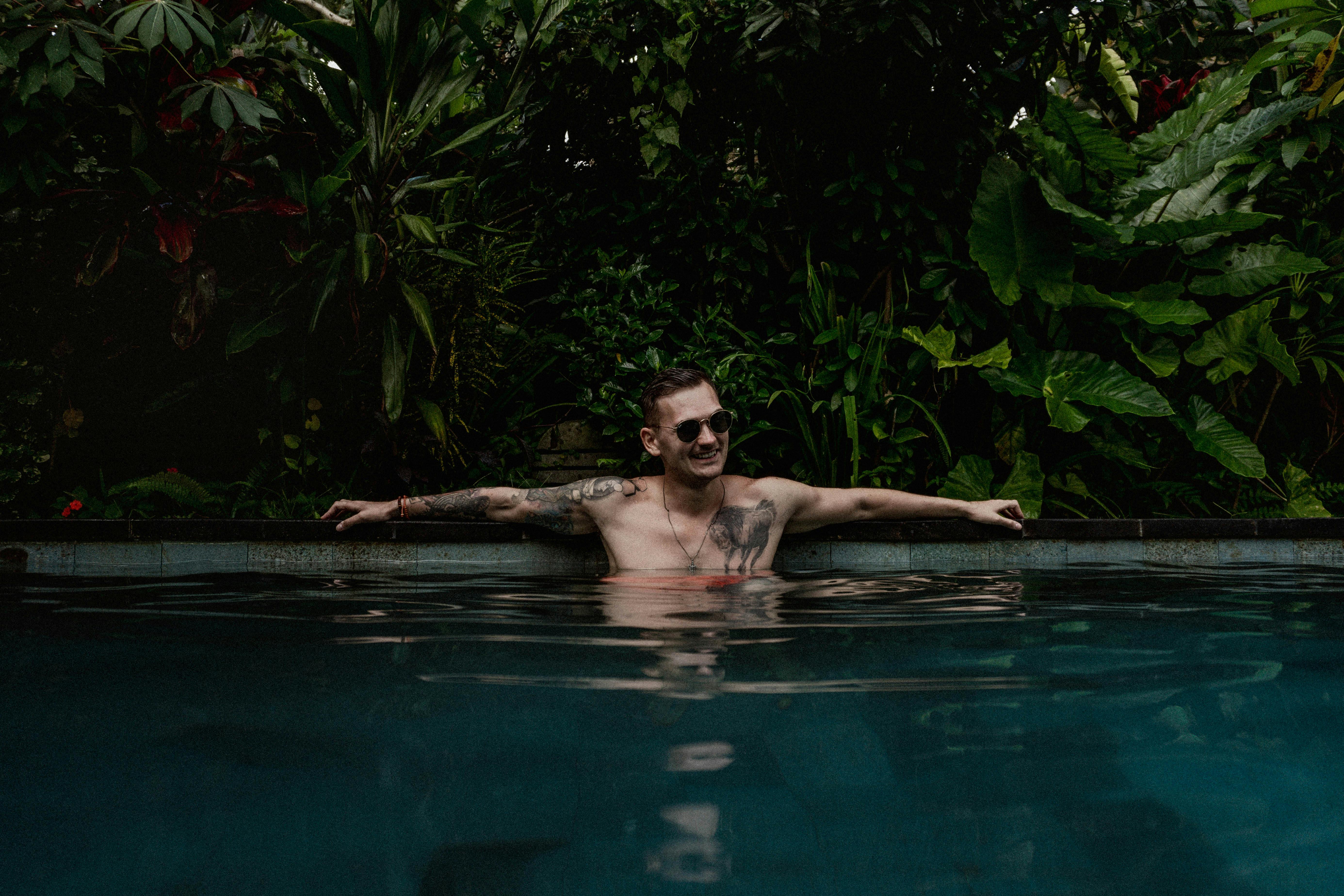 A Smiling Man in the Swimming Pool · Free Stock Photo