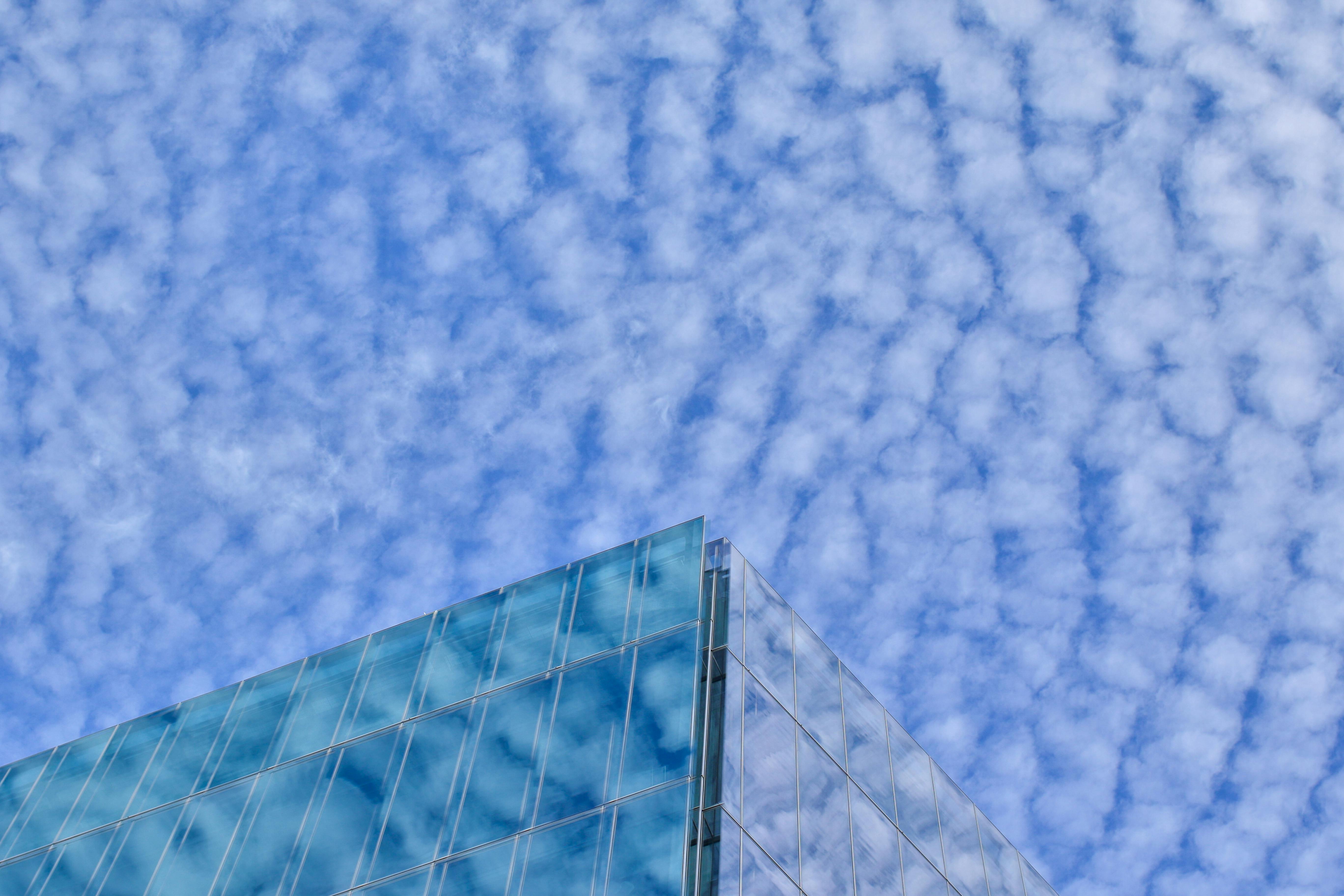 Clouds and Glass Building · Free Stock Photo
