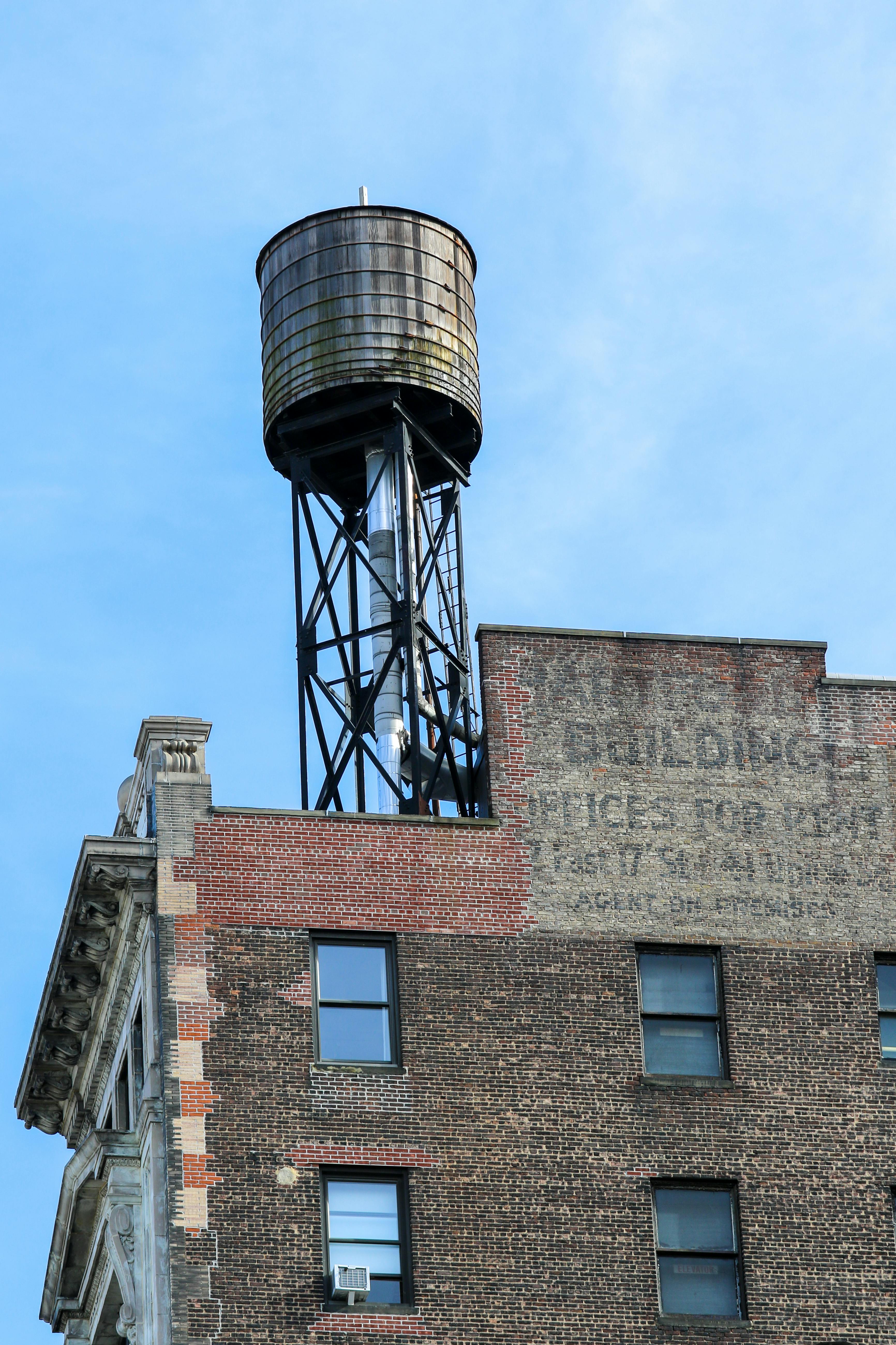 Rusty Water Tank Under Blue Sky · Free Stock Photo