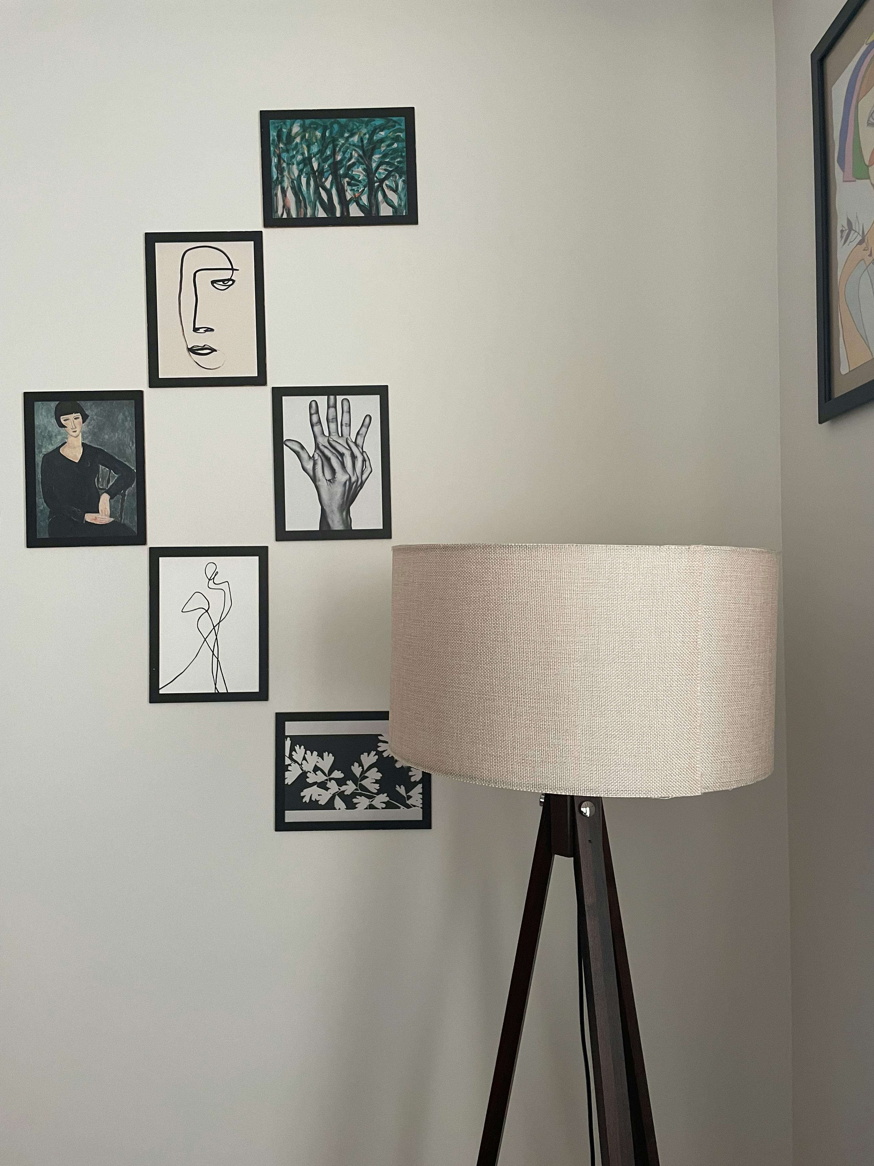 Pictures in Frames on Wall by Lamp · Free Stock Photo