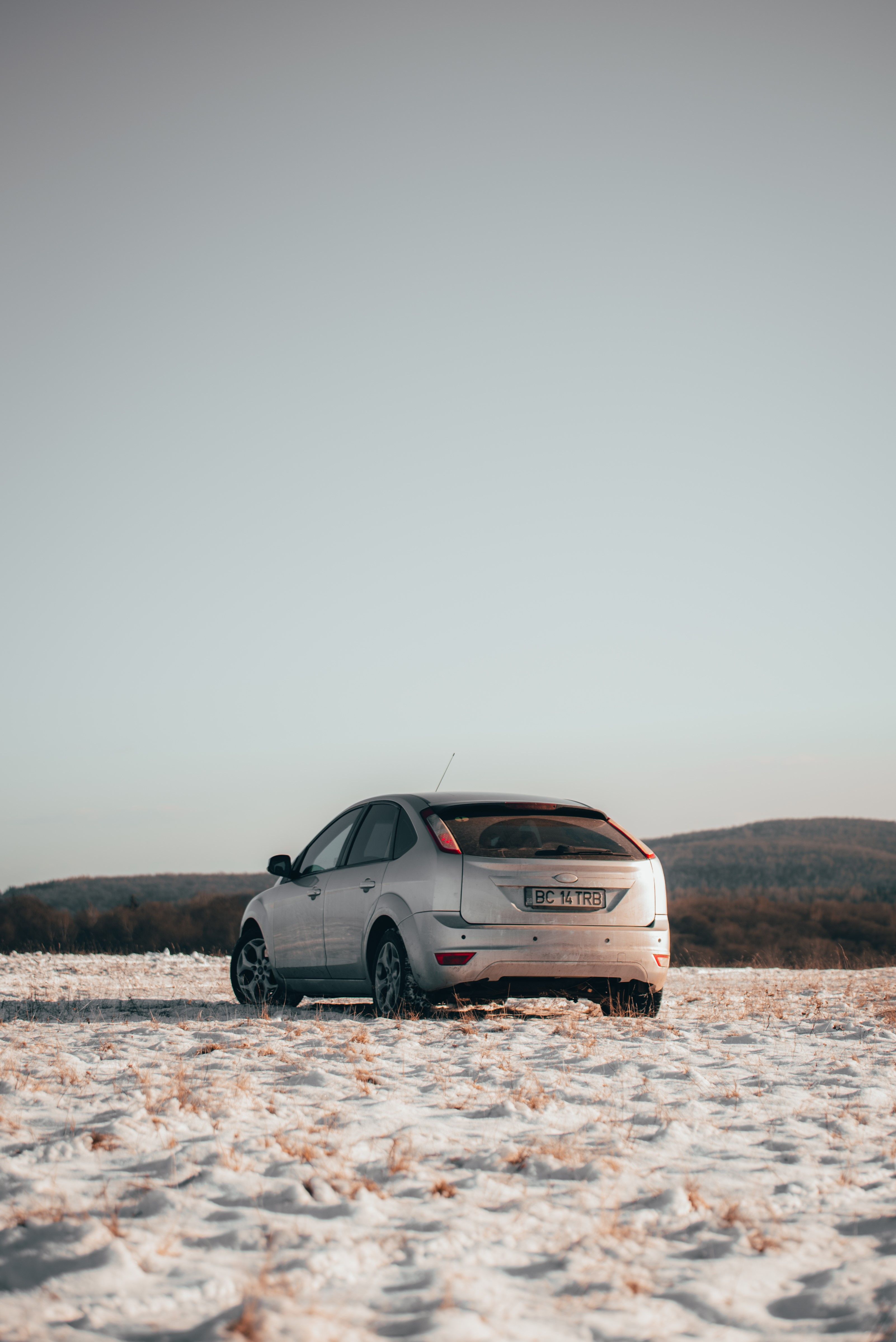 A Ford Focus on a Snow Covered Field · Free Stock Photo
