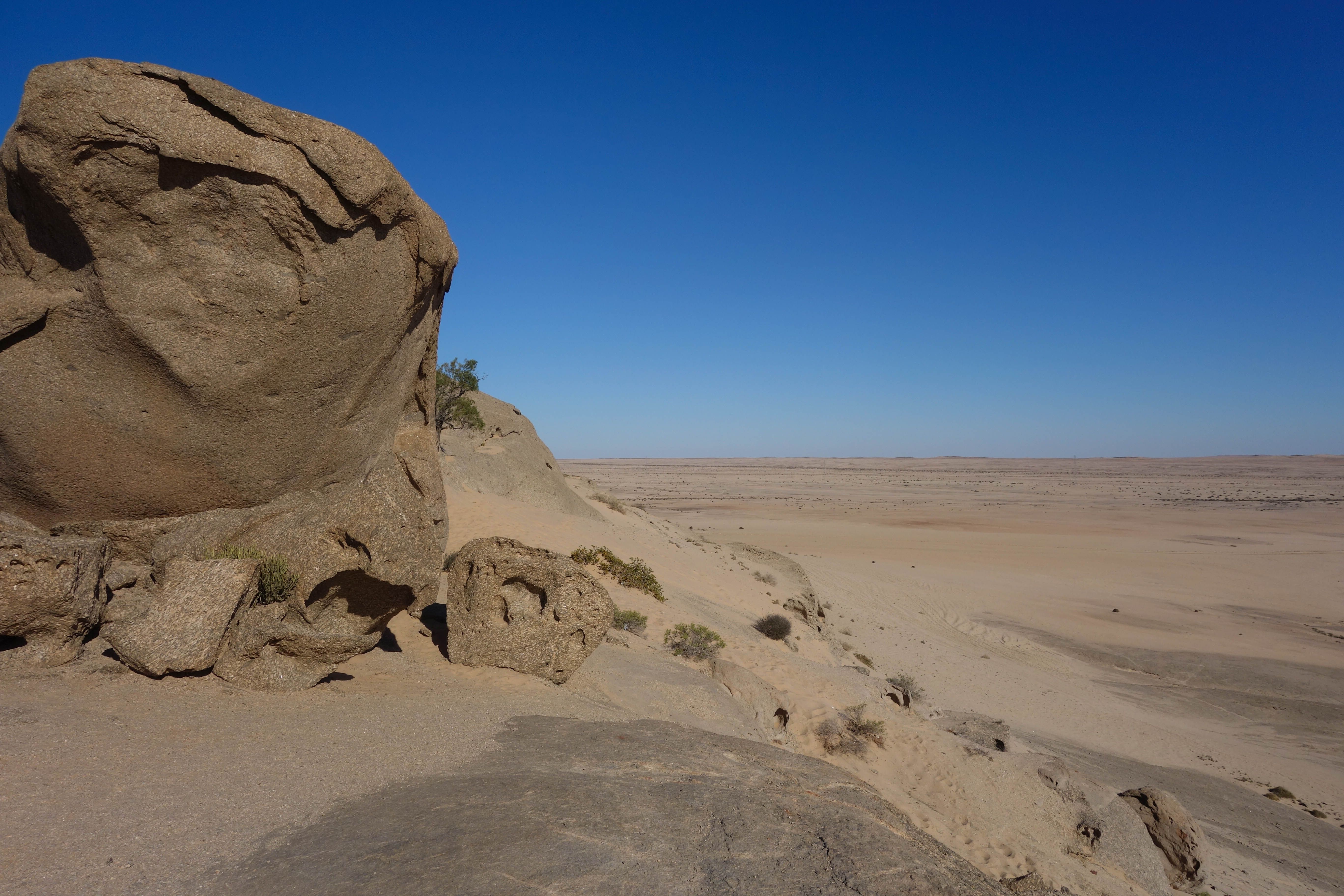 A Rock Formation under a Clear Blue Sky · Free Stock Photo