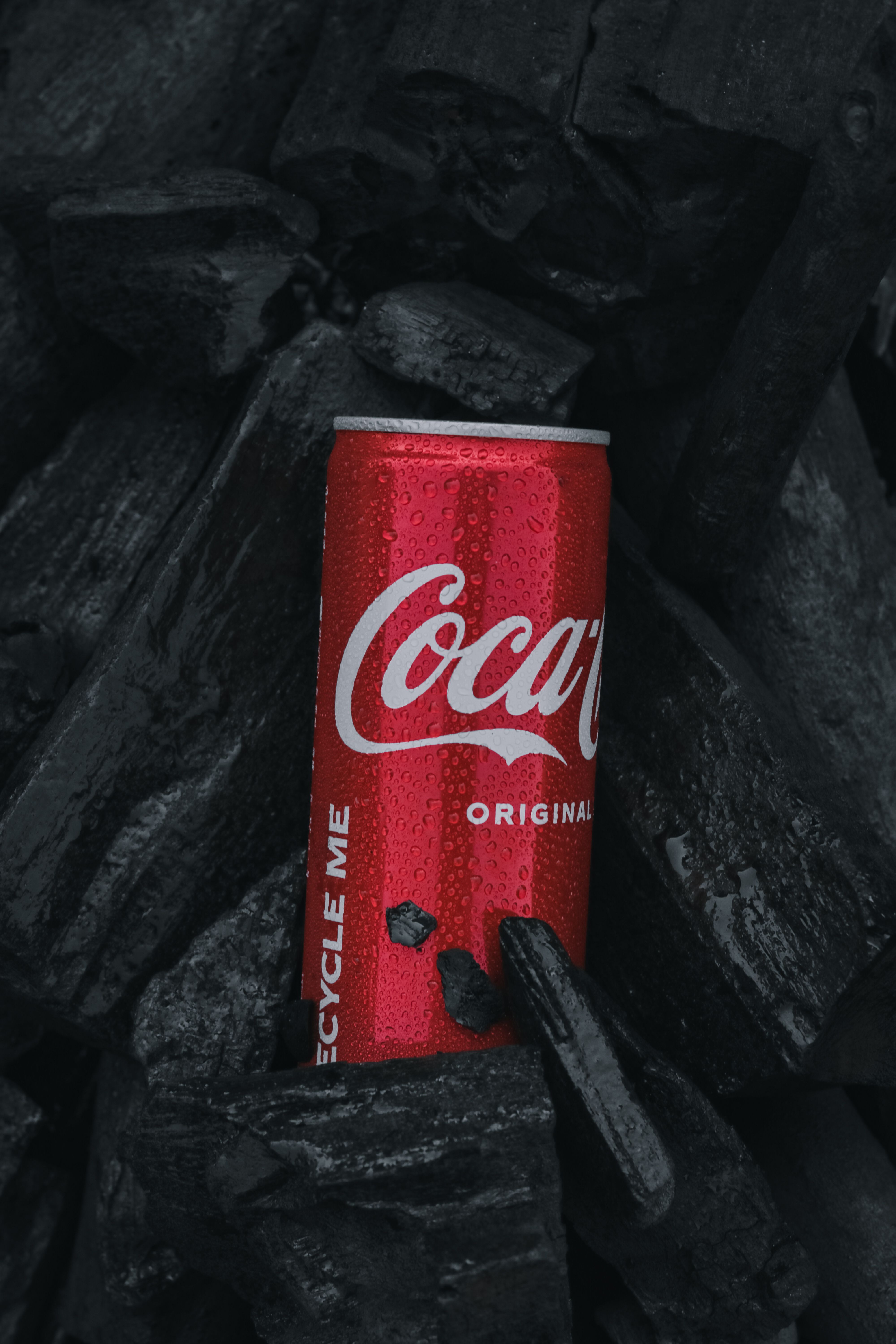 Coca-Cola Can on Glass Surface · Free Stock Photo