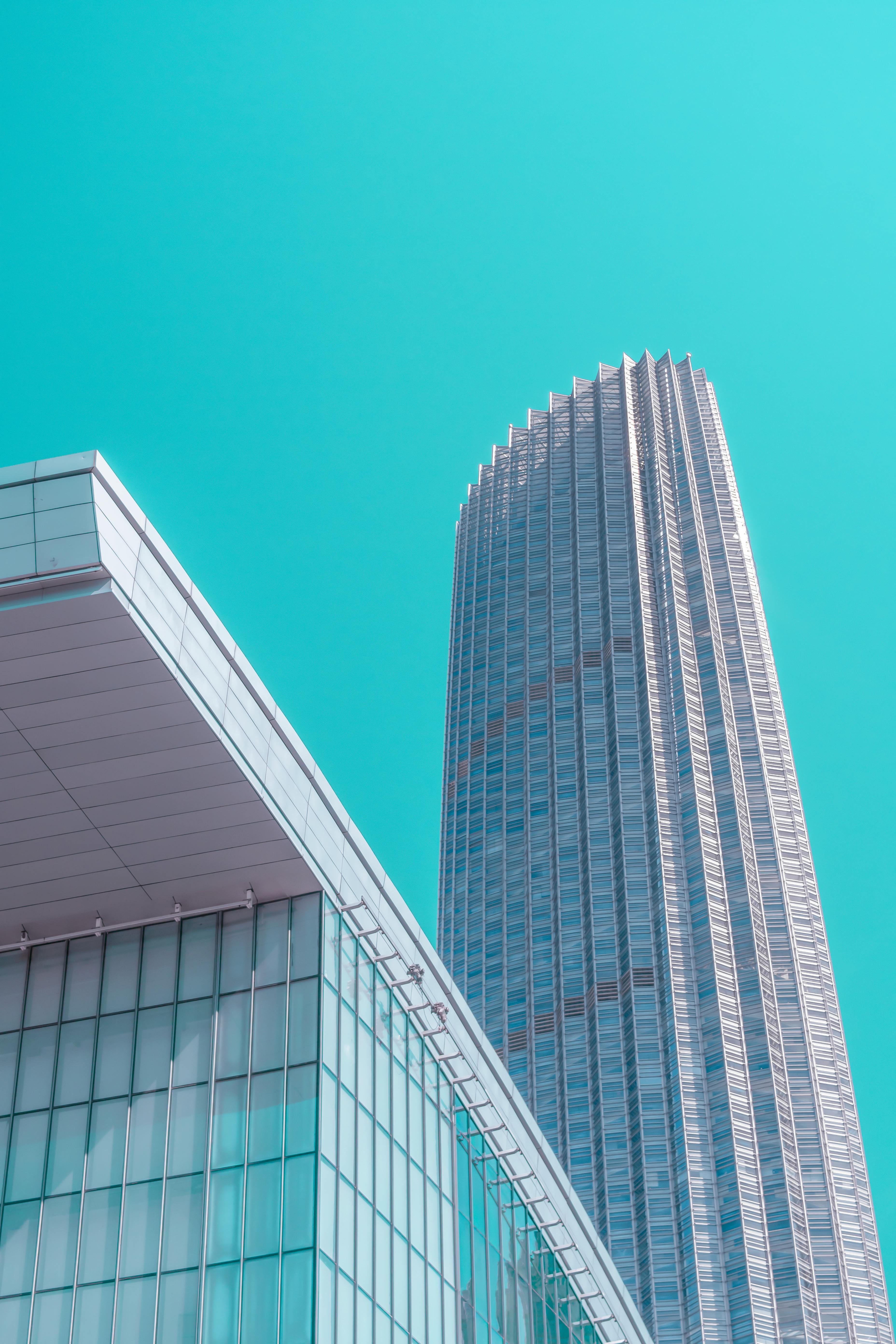 Low Angle Shot of High Rise Building Under Blue Sky · Free Stock Photo