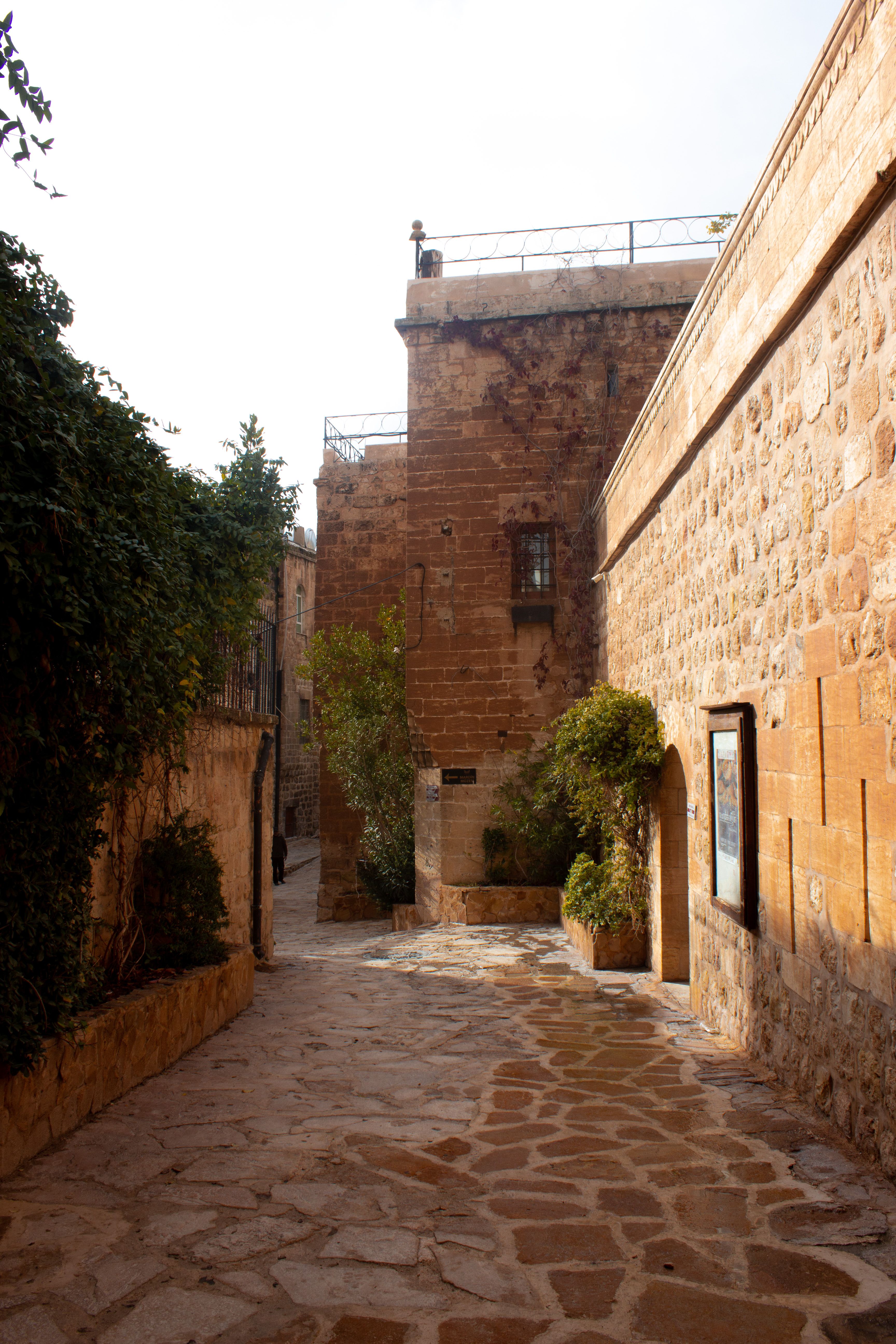 Low-Angle Shot of Alleyway and Houses under the Sky · Free Stock Photo