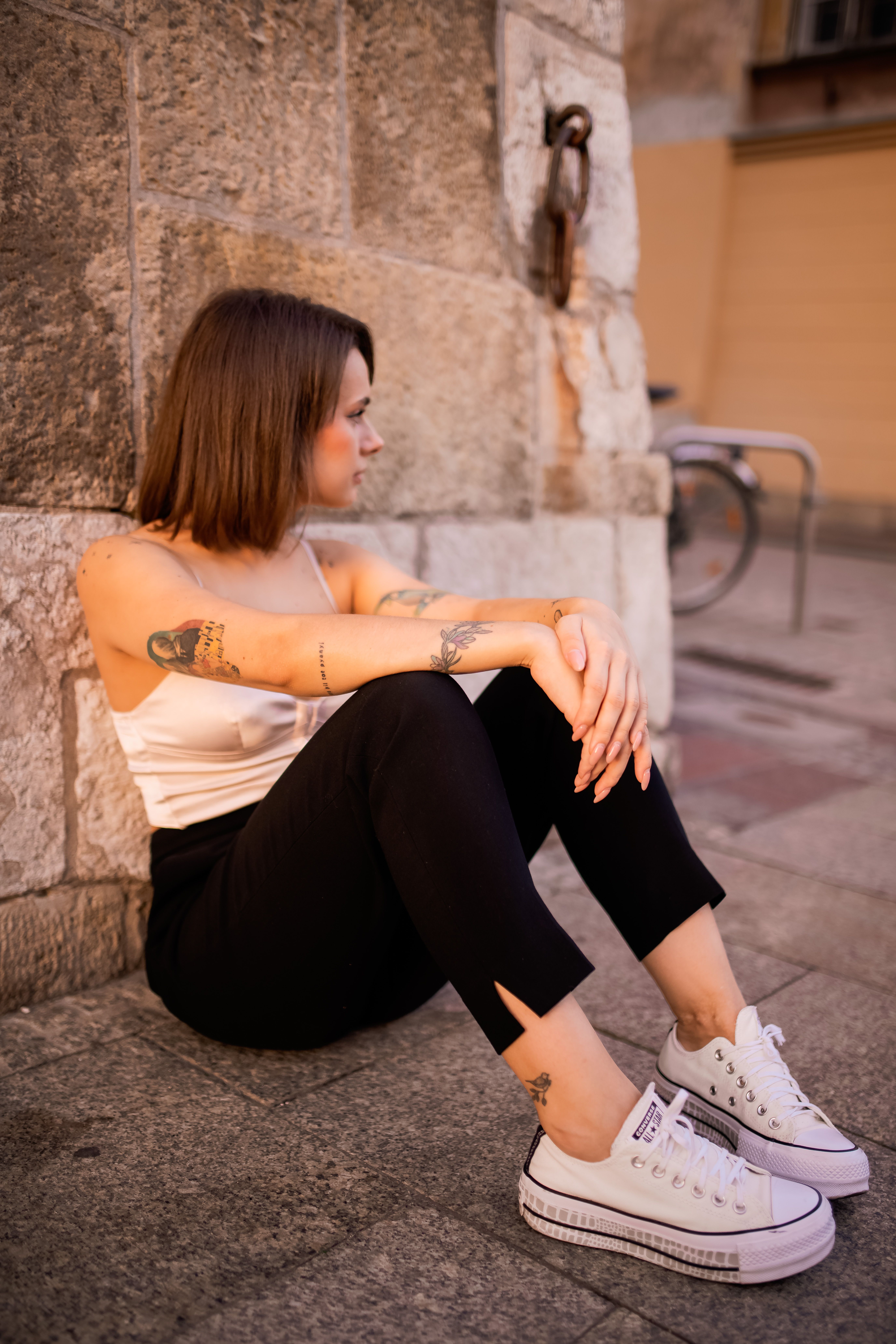 Woman with Arm Tattoo Sitting on the Floor · Free Stock Photo