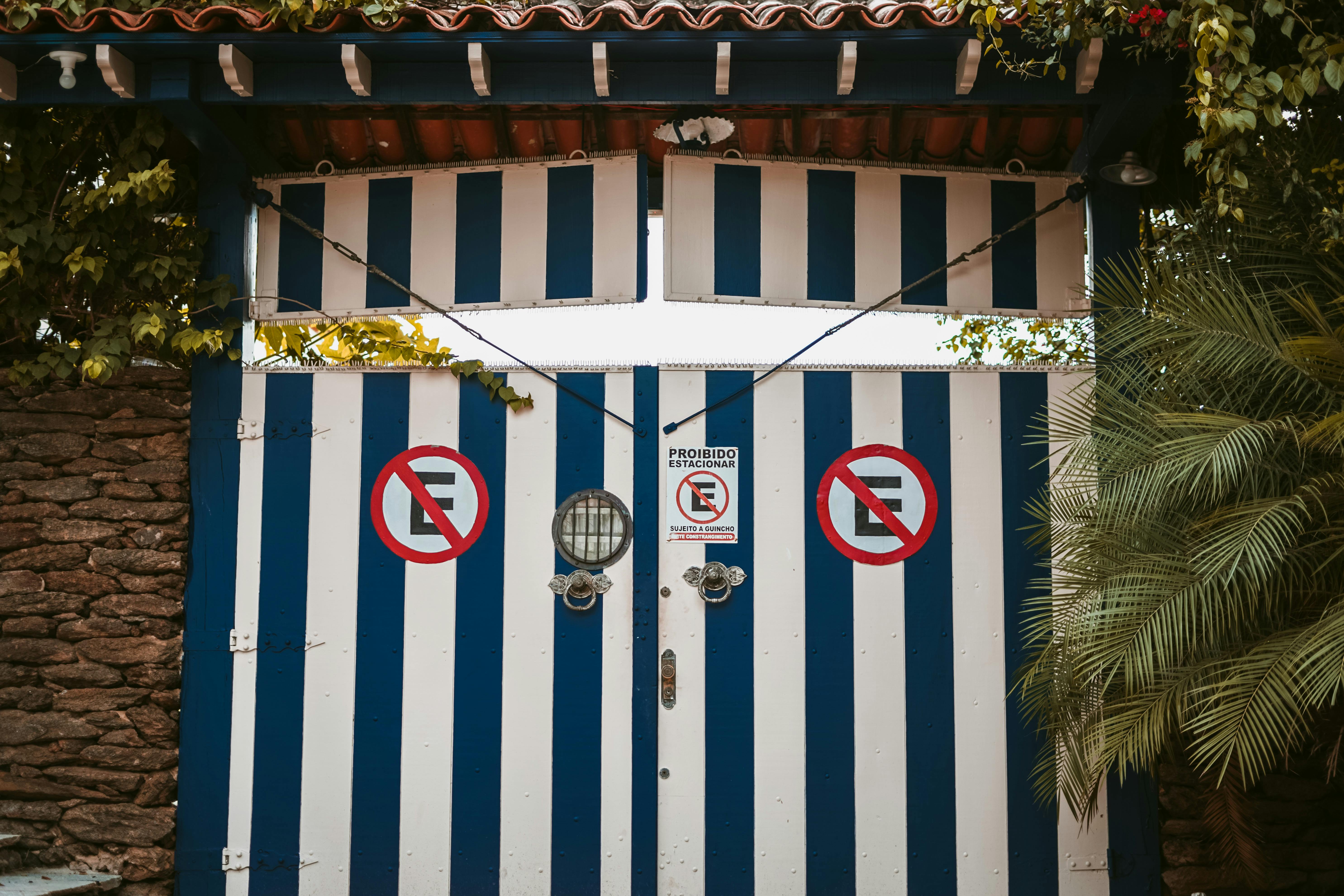 Striped Gate in Stone Wall · Free Stock Photo