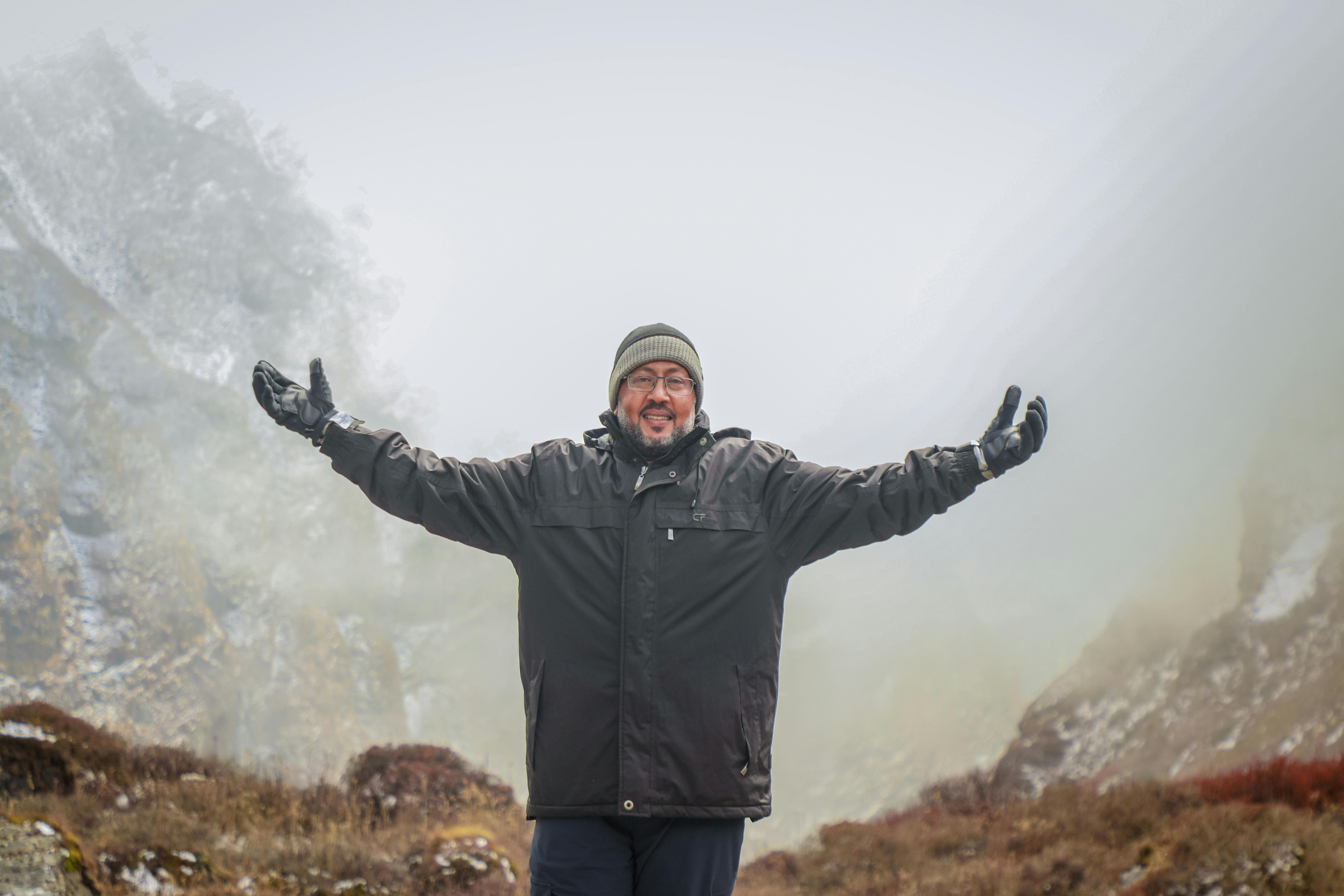 Man Wearing Black Jacket with His Arms Open · Free Stock Photo