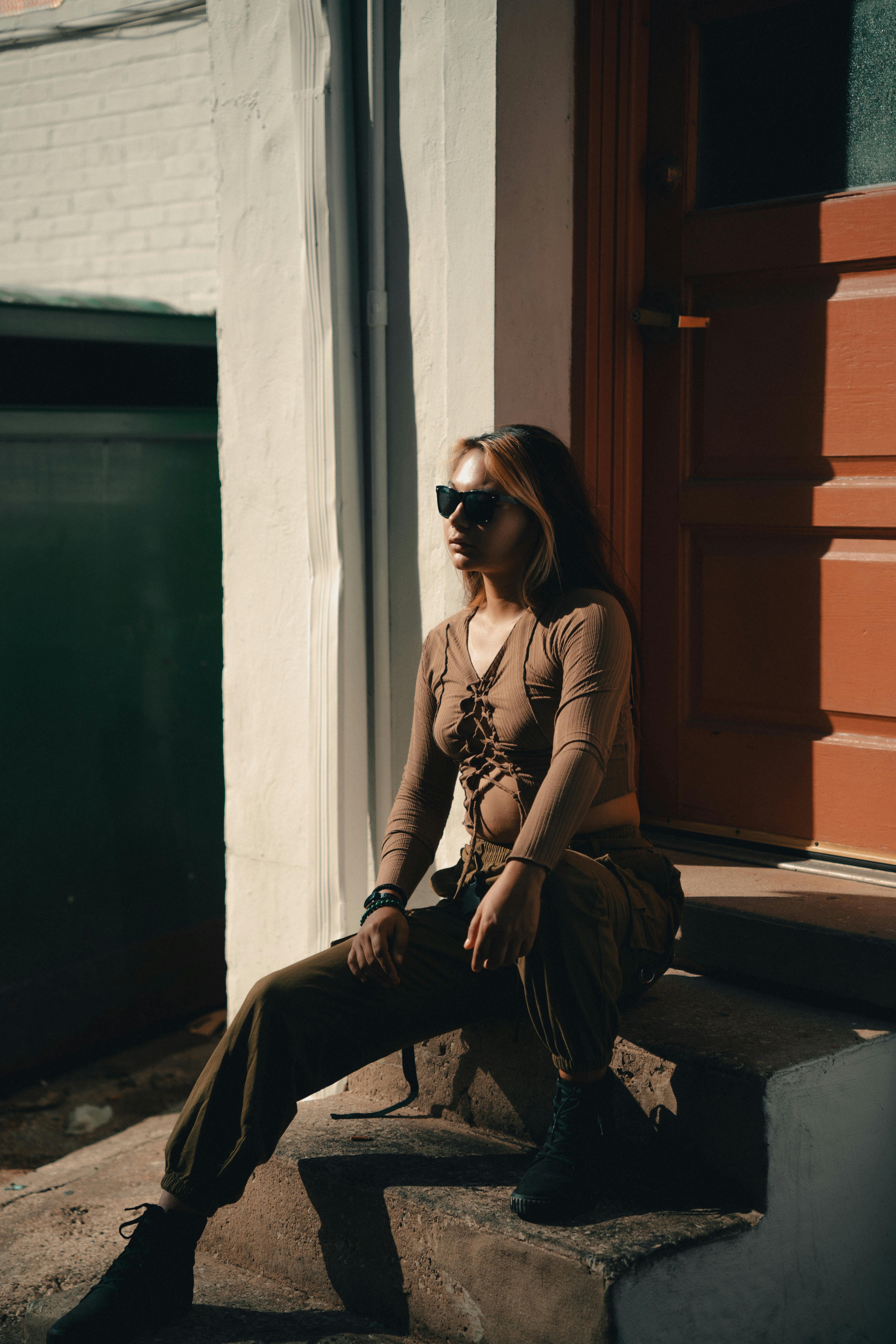 Woman in Lace White Top Sitting on Step by Door · Free Stock Photo