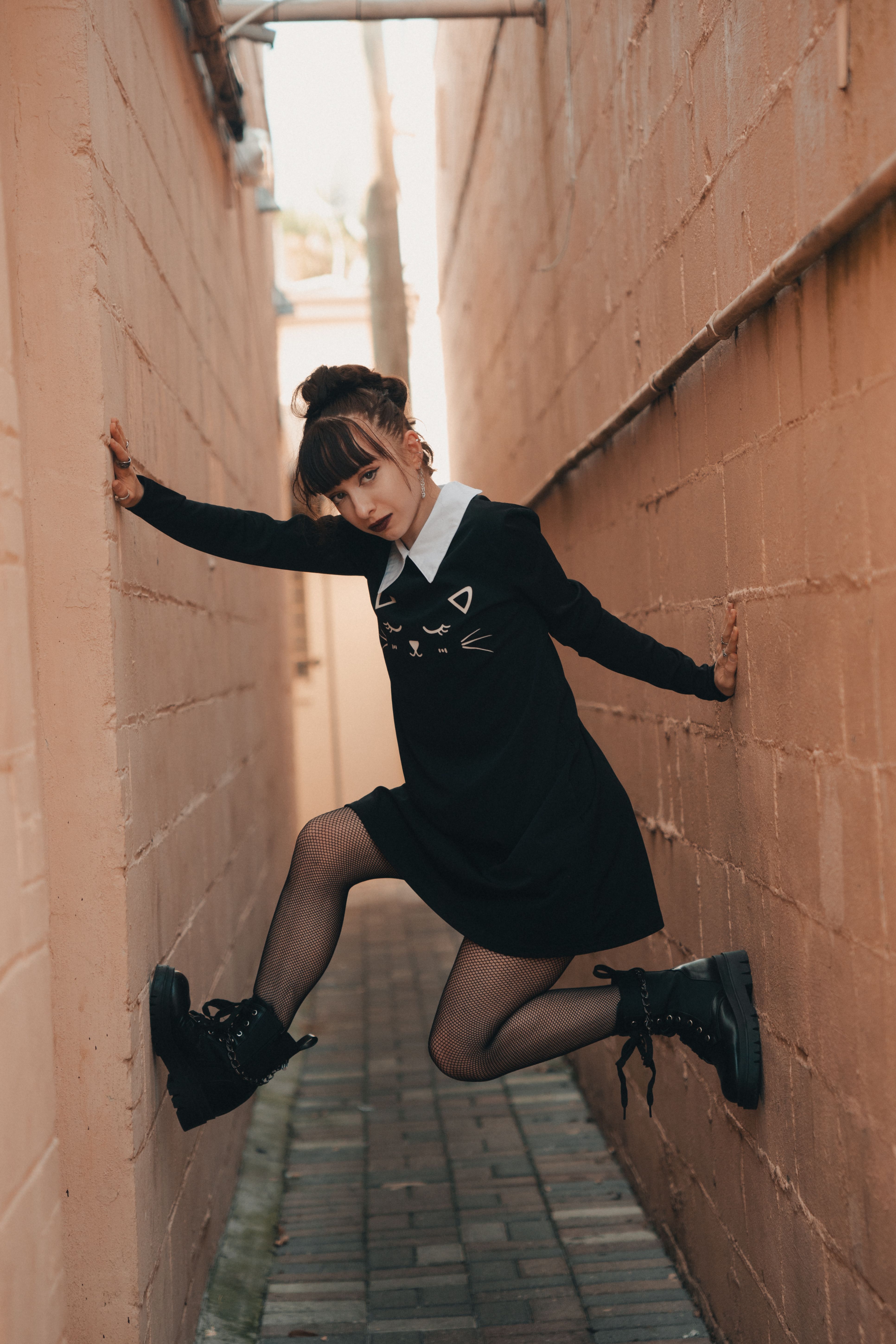 Woman Posing Between Walls · Free Stock Photo