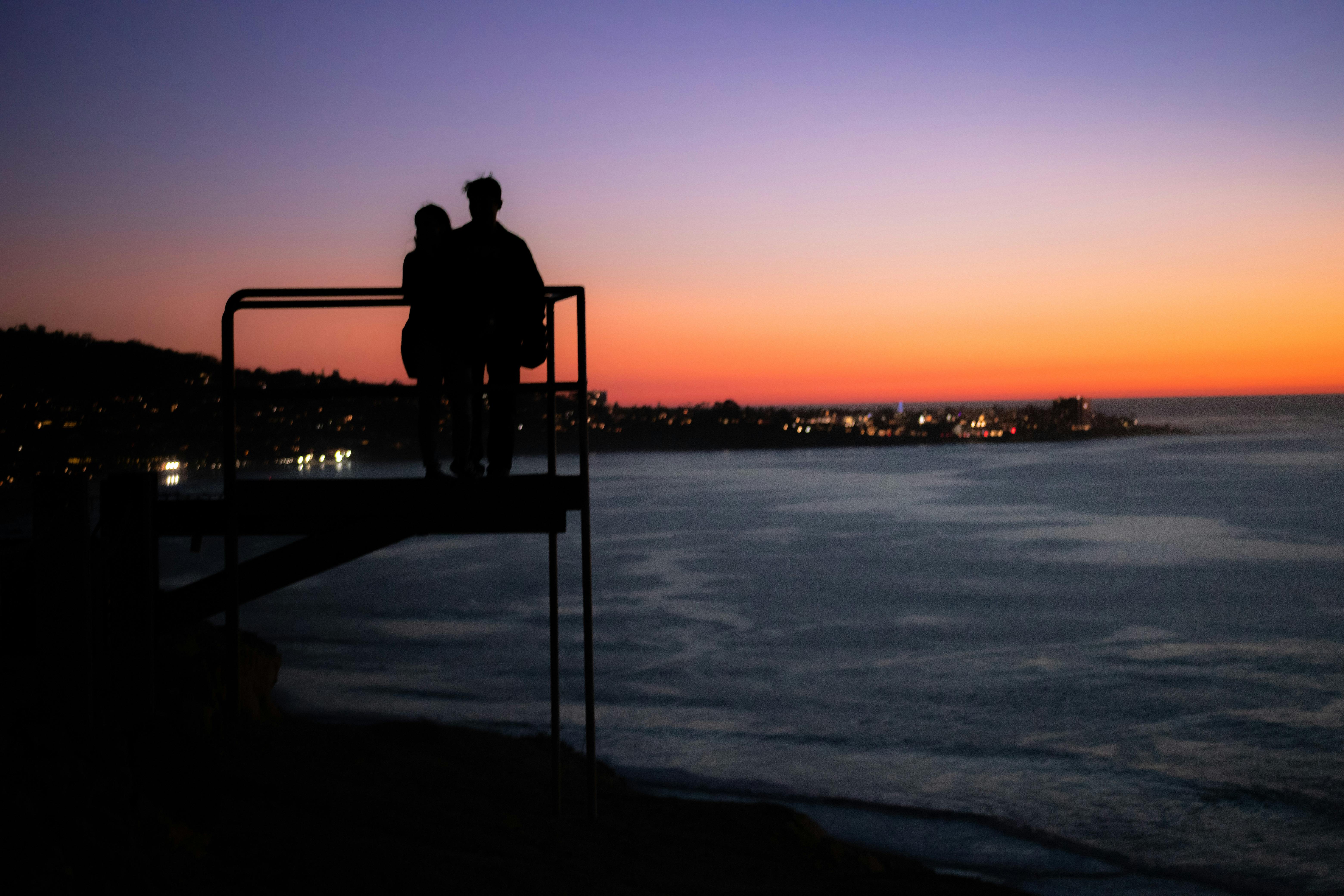 Silhouette of Couple on the Beach · Free Stock Photo