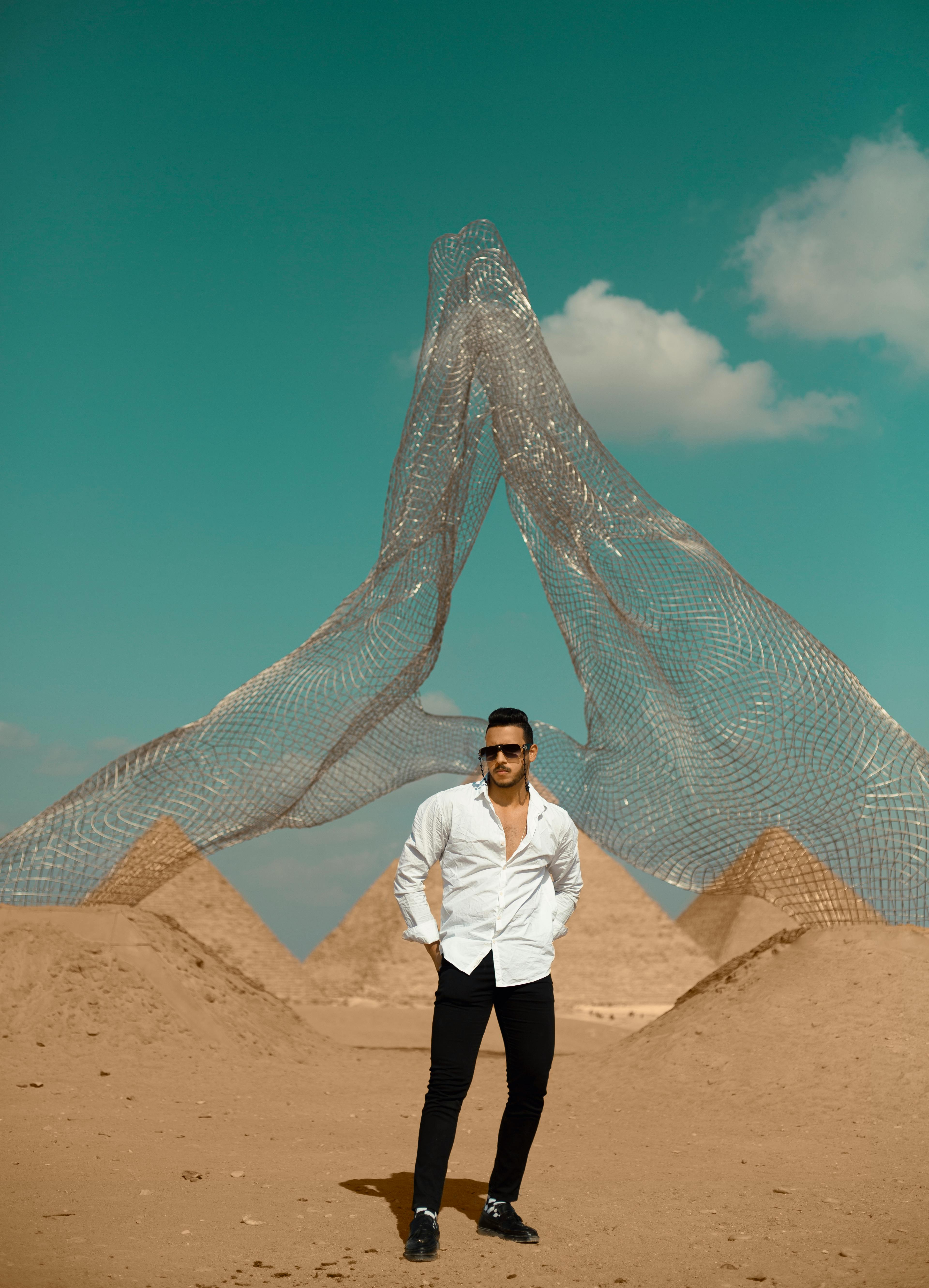 Man against Together Sculpture by Pyramids in Giza · Free Stock Photo