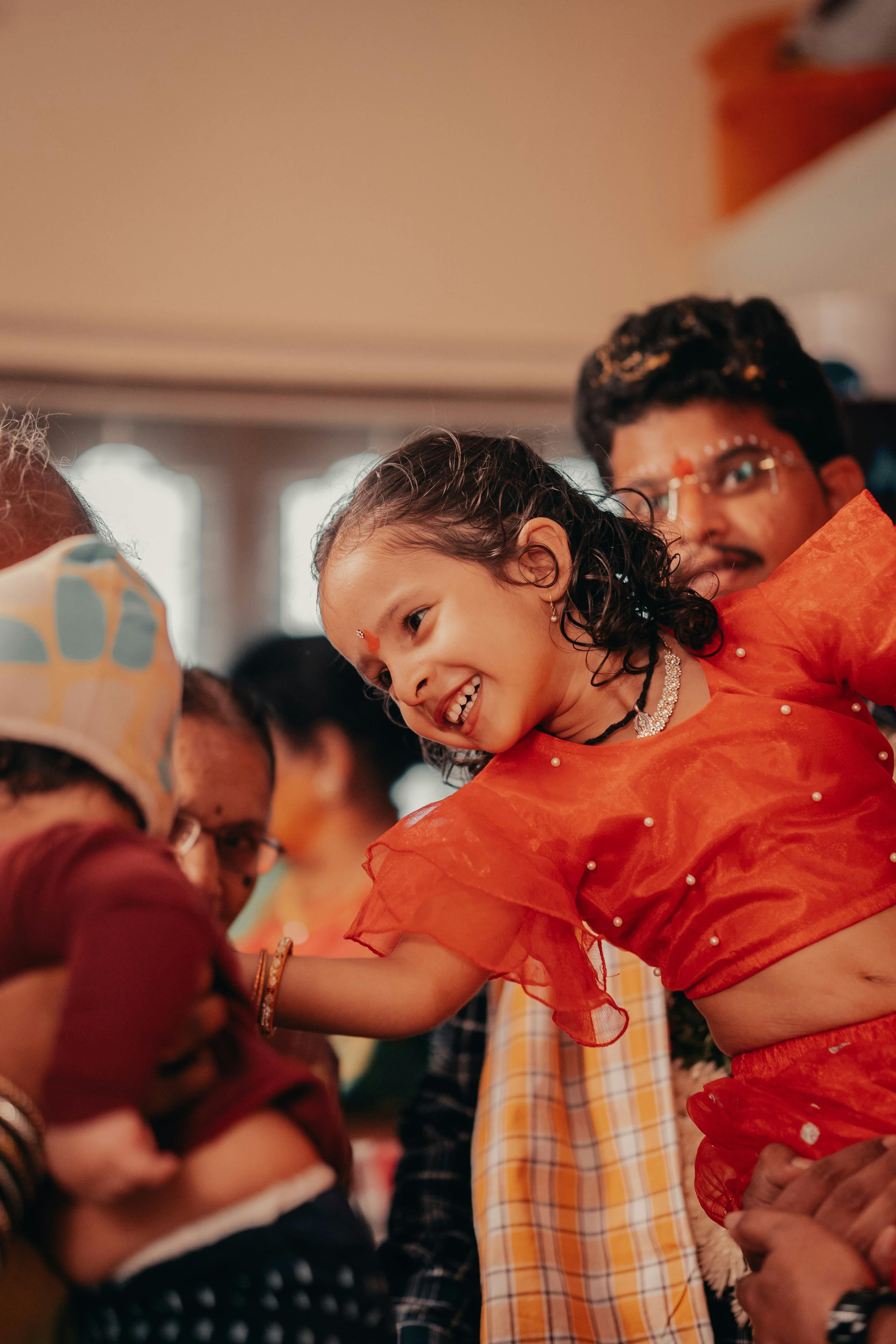 Girl in Traditional Clothing Fixing the Garland on Her Neck · Free ...