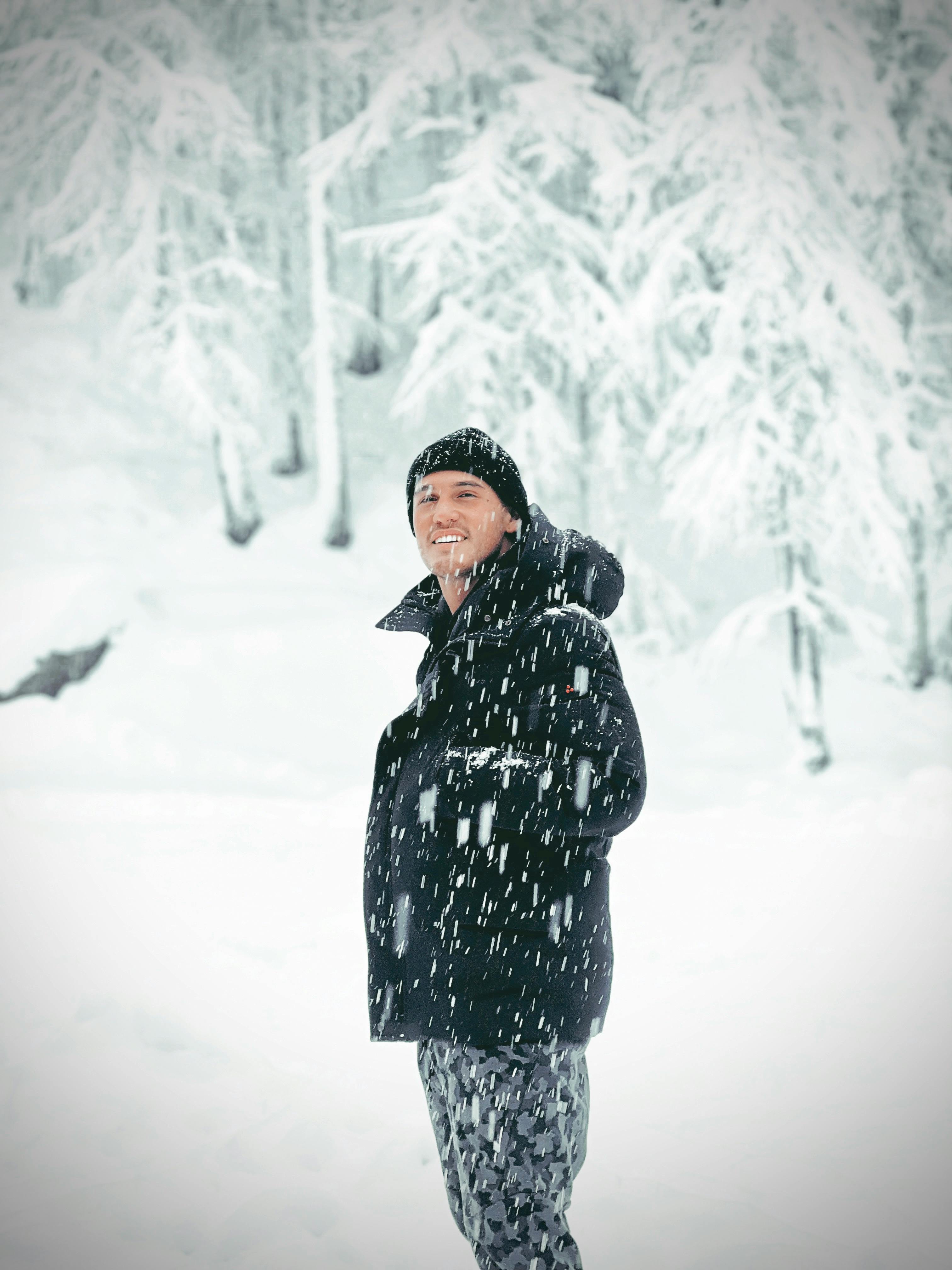 Man in Black Coat Smiling in The Snow · Free Stock Photo