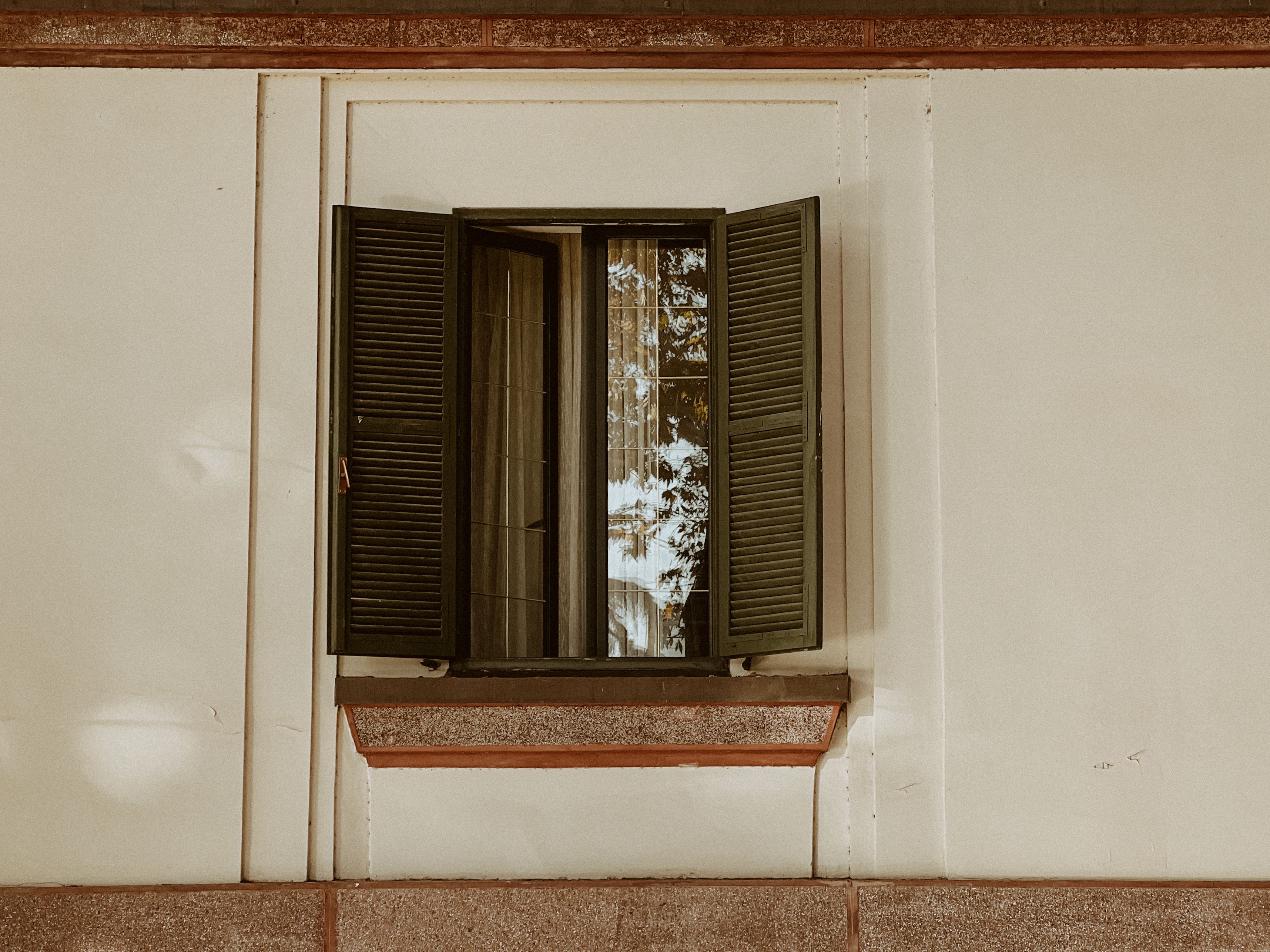 Close-up of a Window with Wooden Shutters · Free Stock Photo