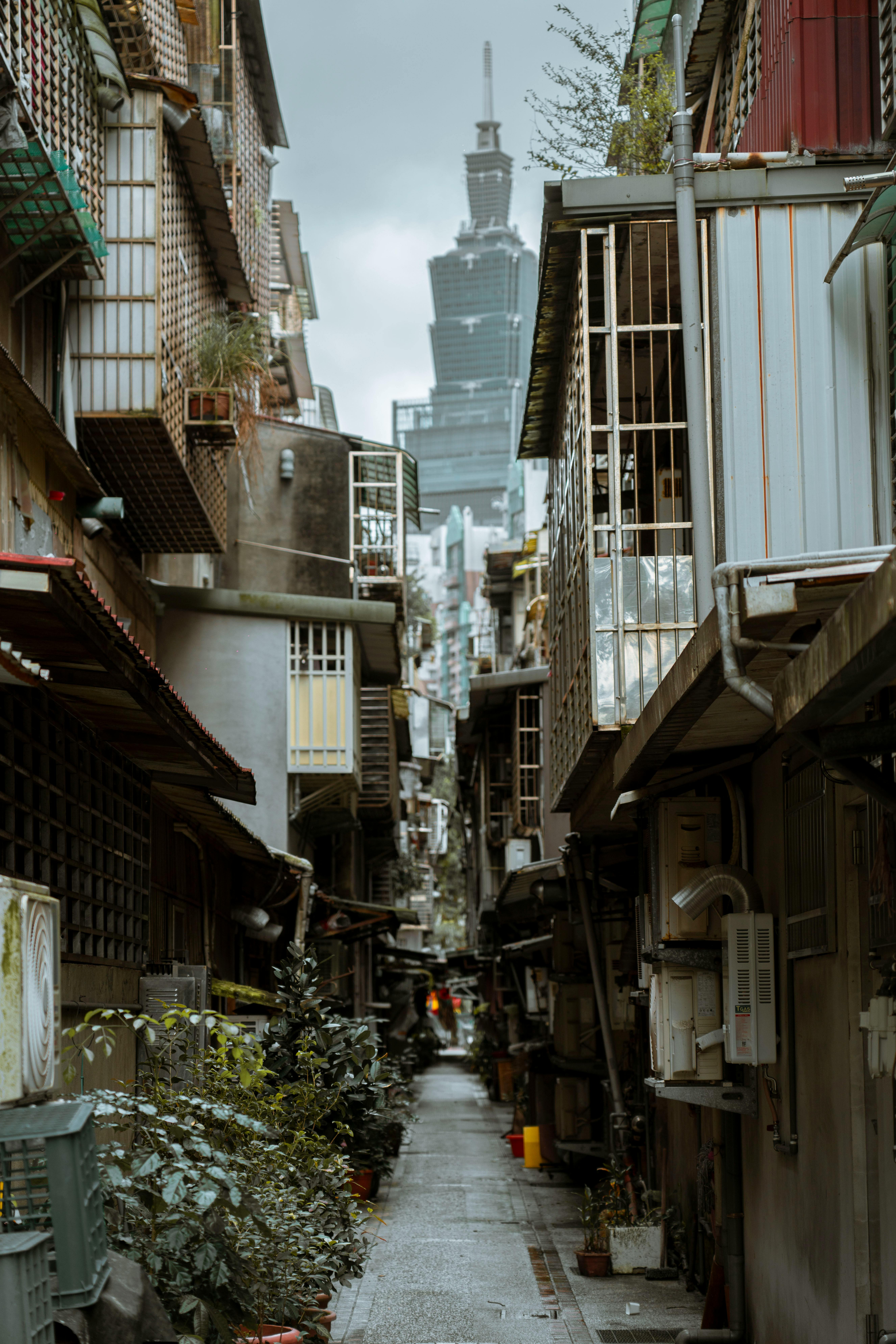 Narrow Alley in Taipei with the View of a Skyscraper Between Houses ...