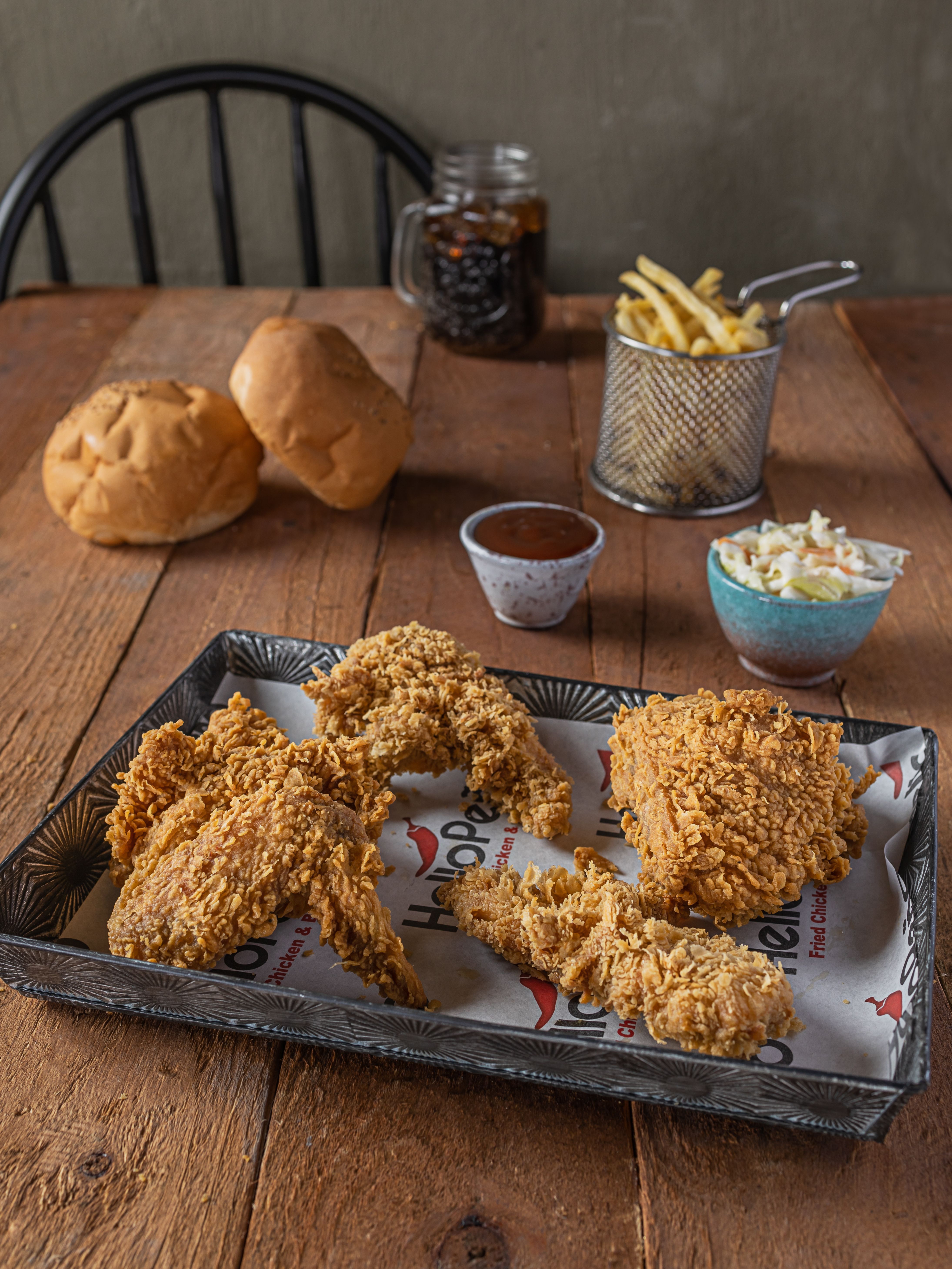 A Bunch of Fried Chicken and Fries on a Woven Basket · Free Stock Photo