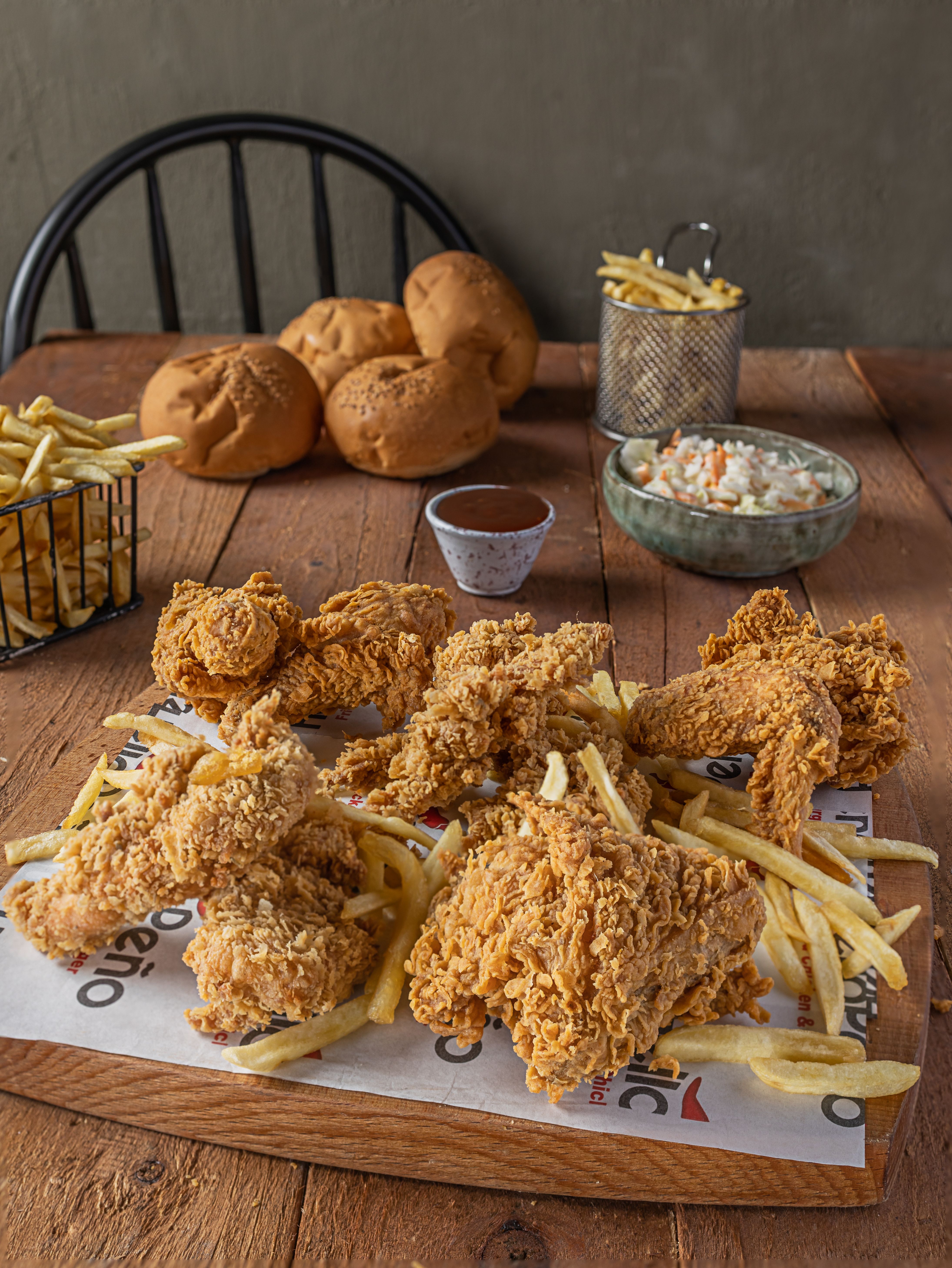 A Bunch of Fried Chicken and Fries on a Woven Basket · Free Stock Photo