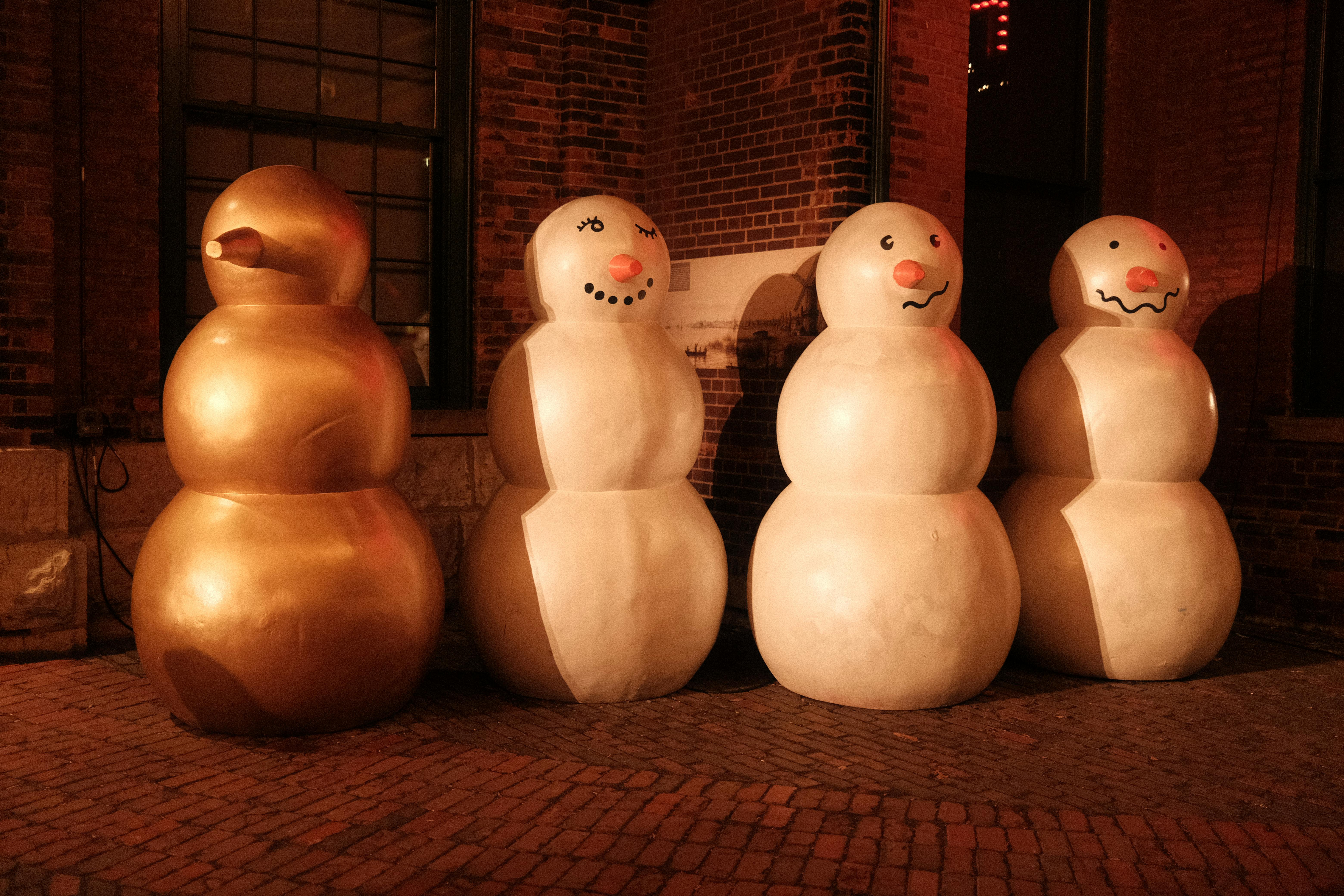 A Set of White and Gold Snowman Decorations · Free Stock Photo