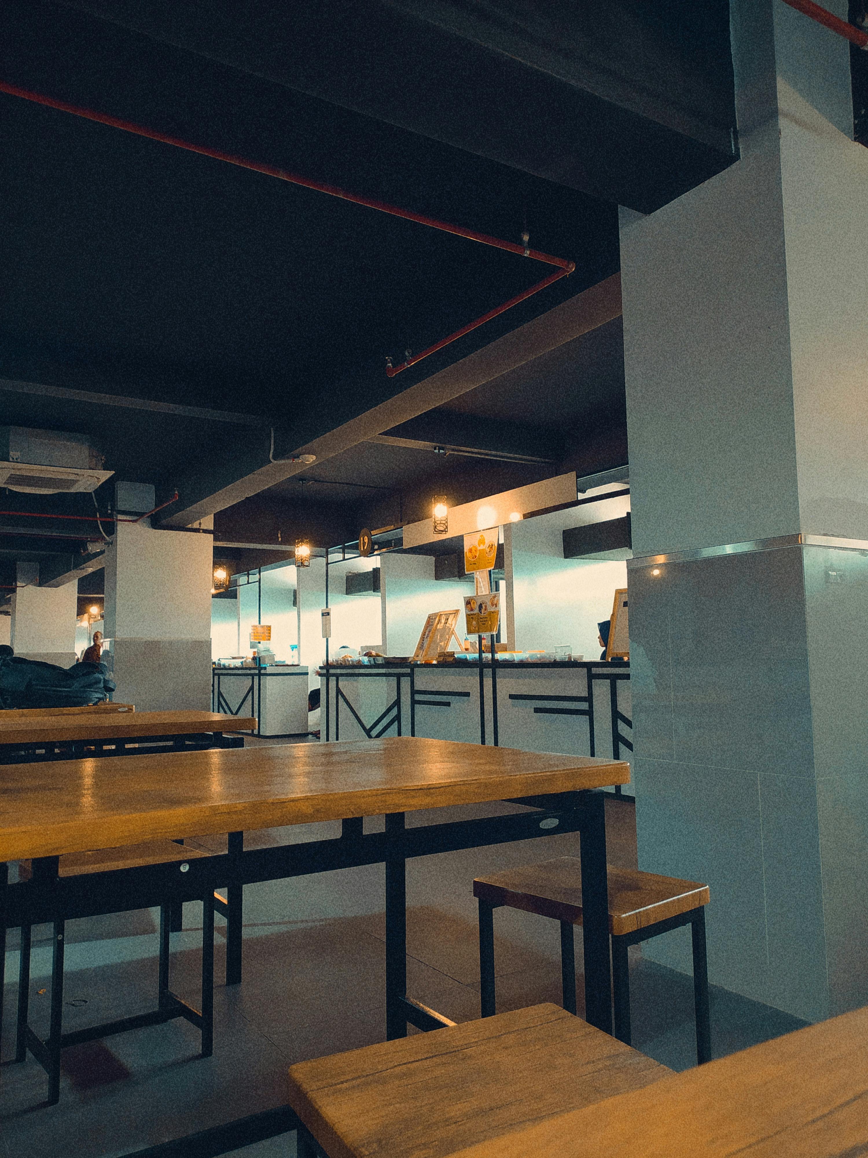 Wooden Chairs and Tables in a Cafeteria · Free Stock Photo