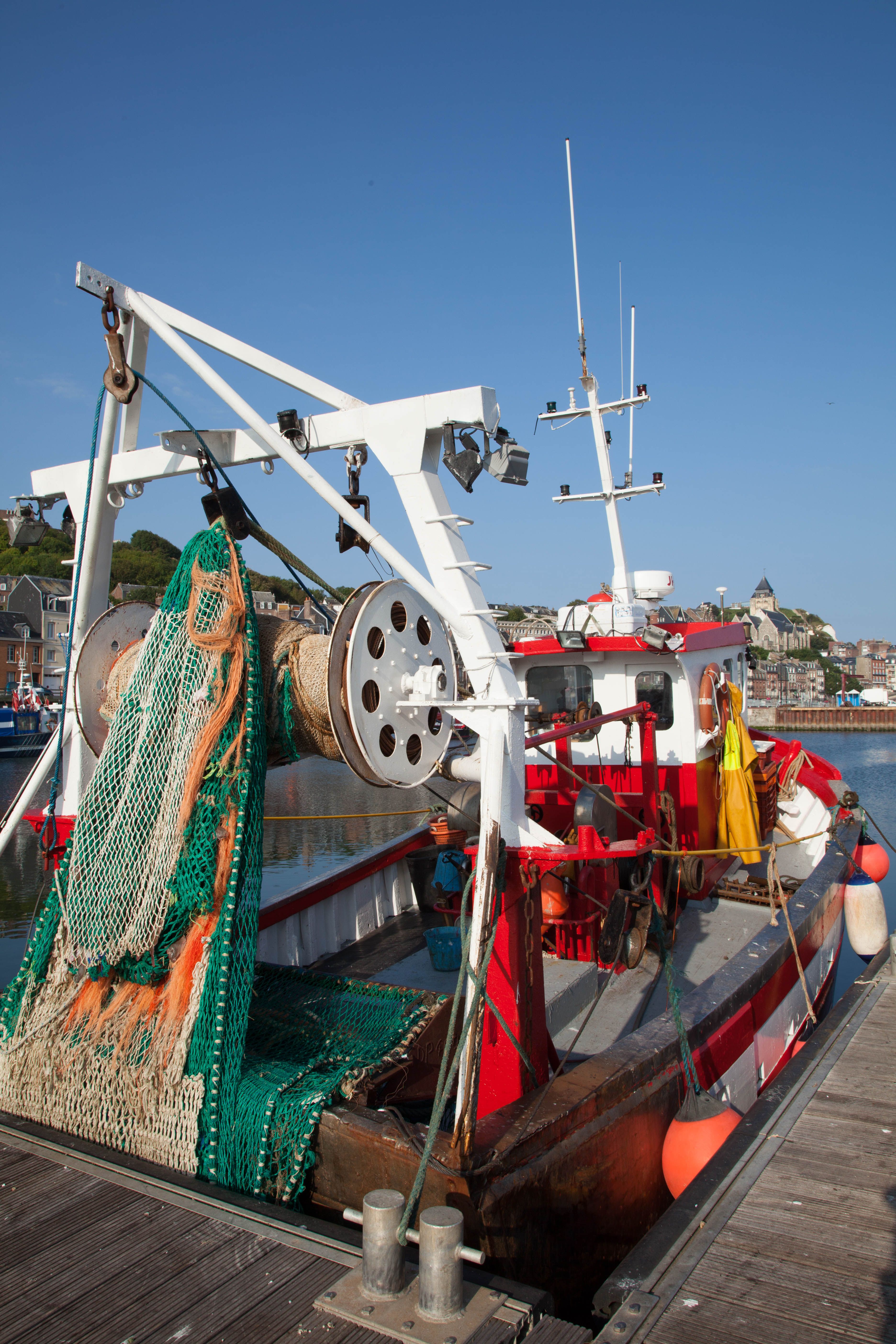 Fishing Boat Beside a Wooden Dock · Free Stock Photo