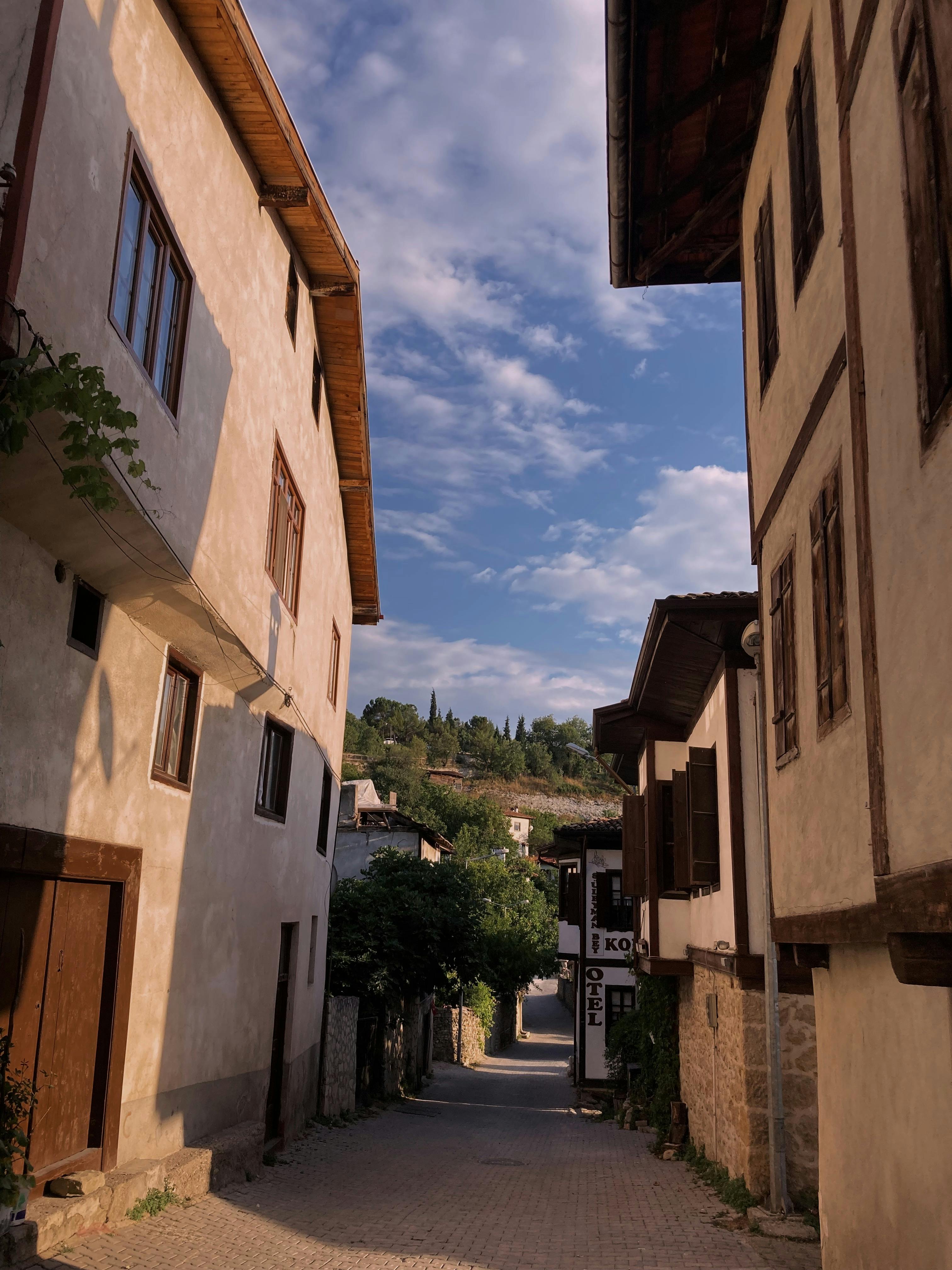 A Street Between Concrete Houses · Free Stock Photo