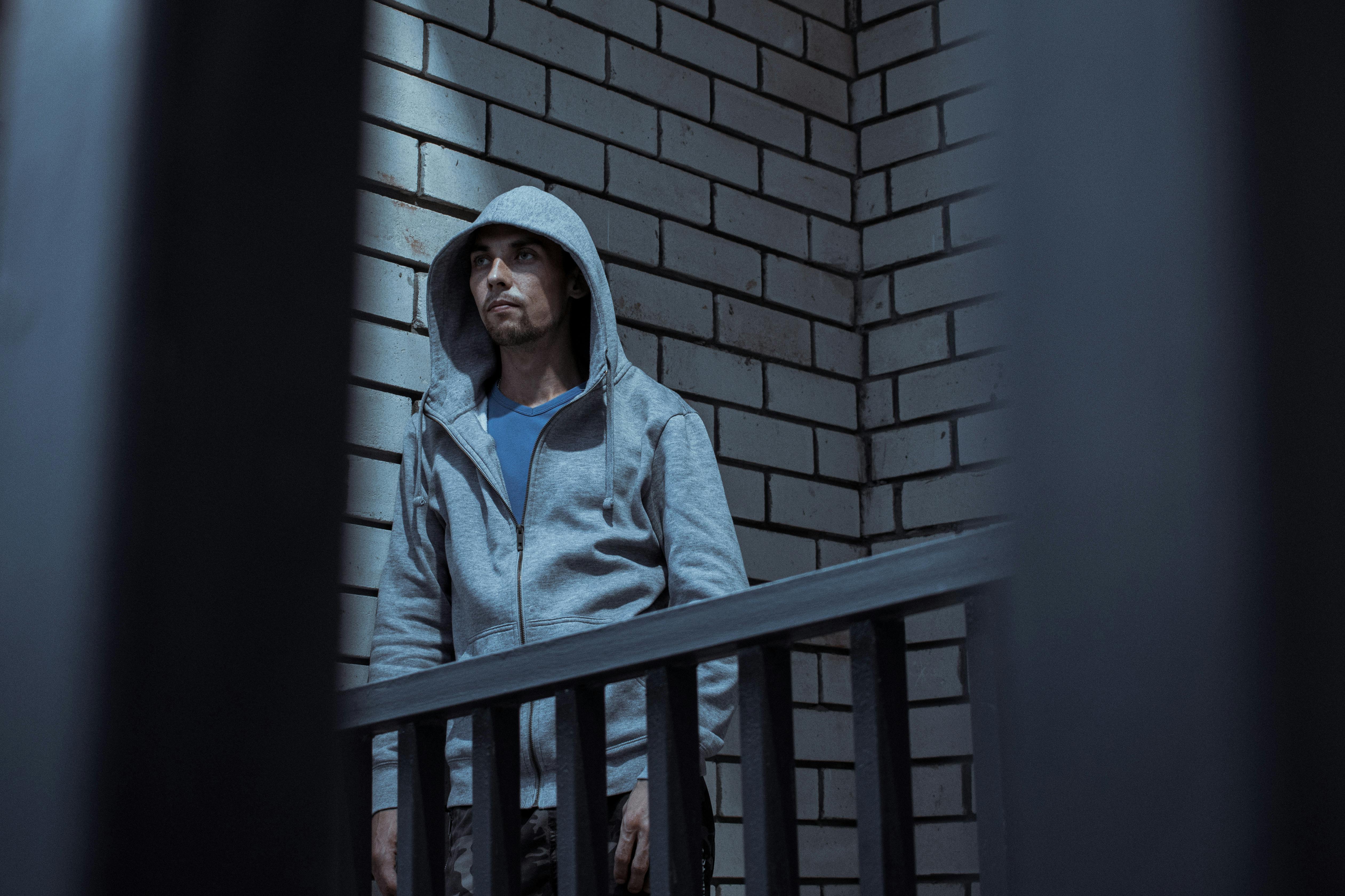 Man Standing Beside Railing · Free Stock Photo