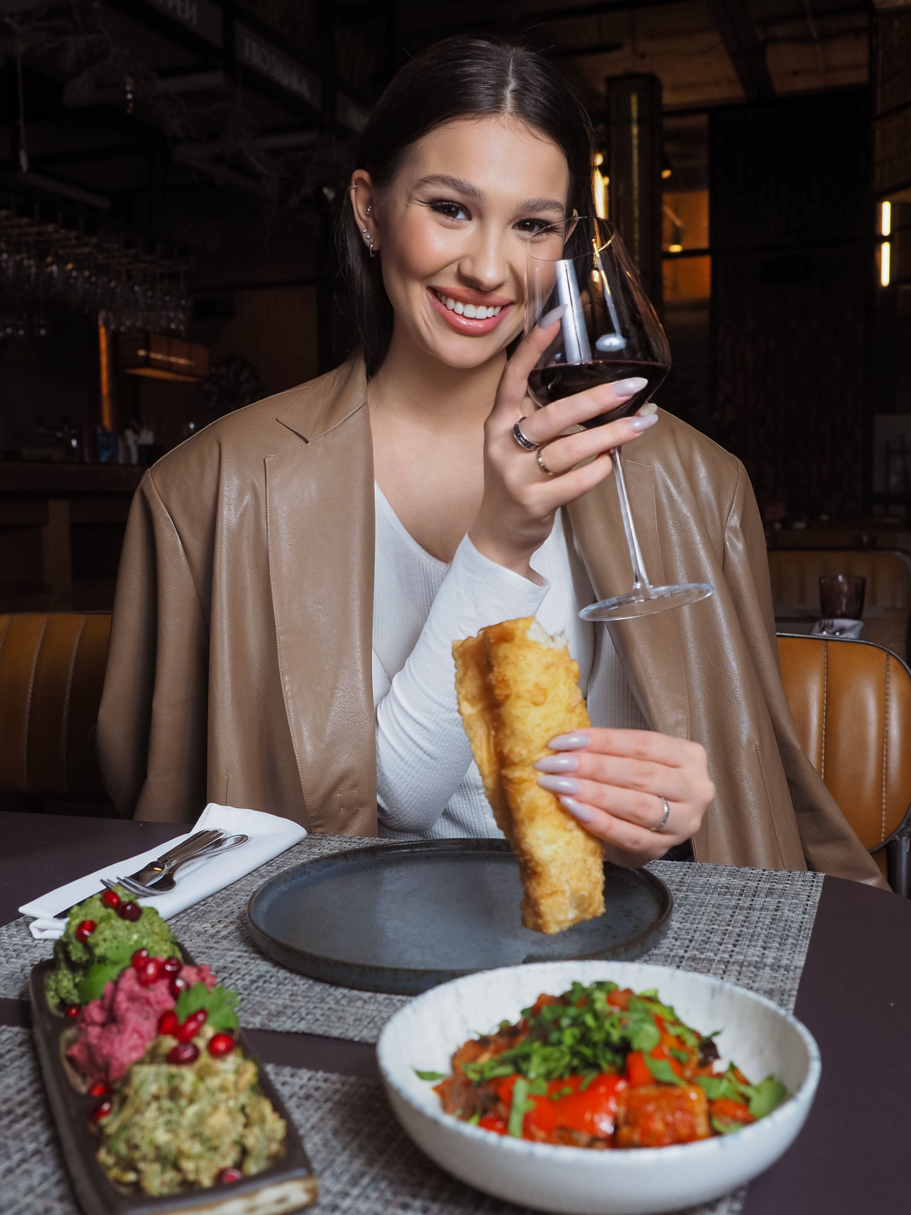 Woman Sitting at Table During Dinner · Free Stock Photo
