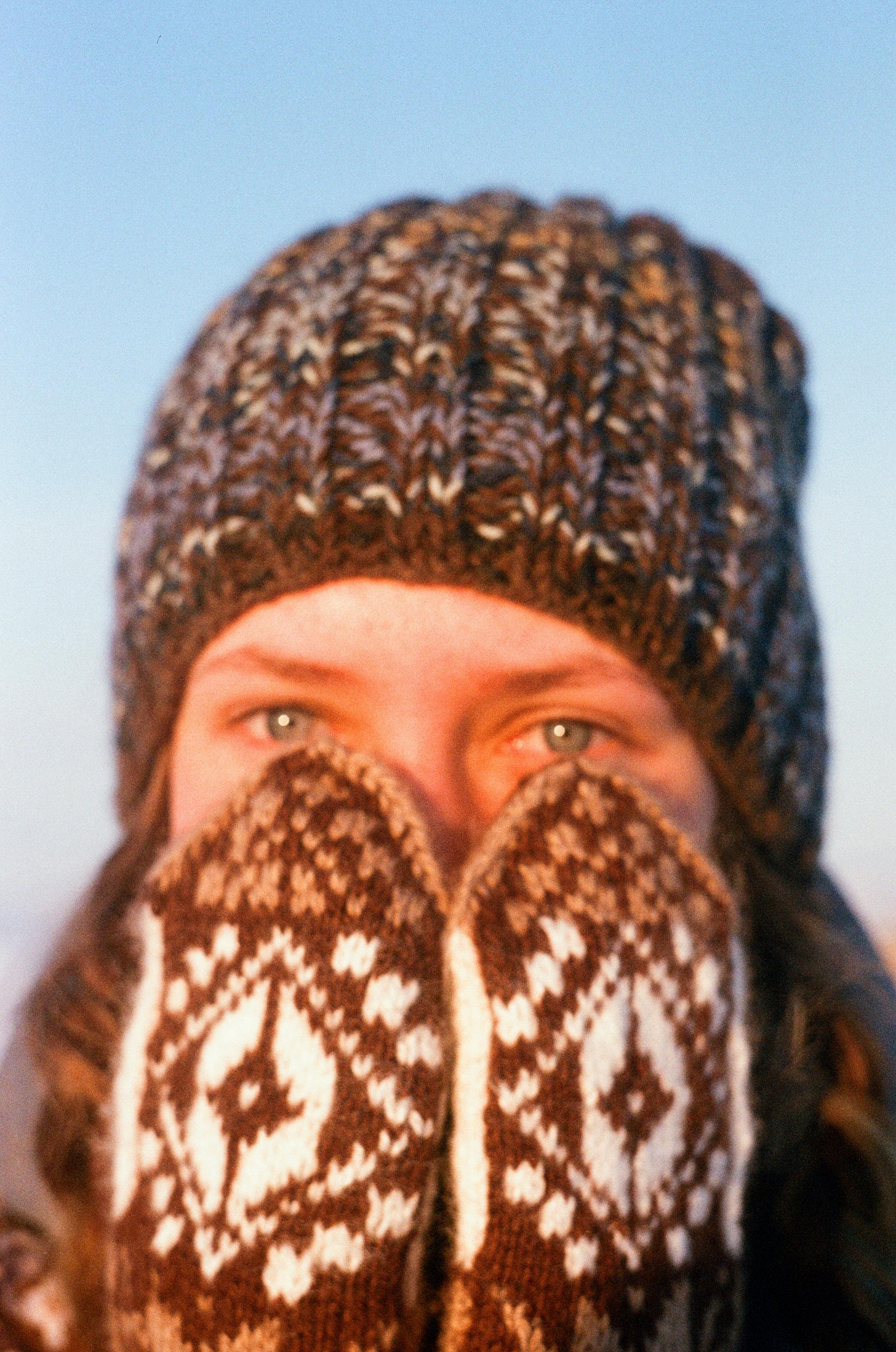 Woman Covering her face with Mittens · Free Stock Photo