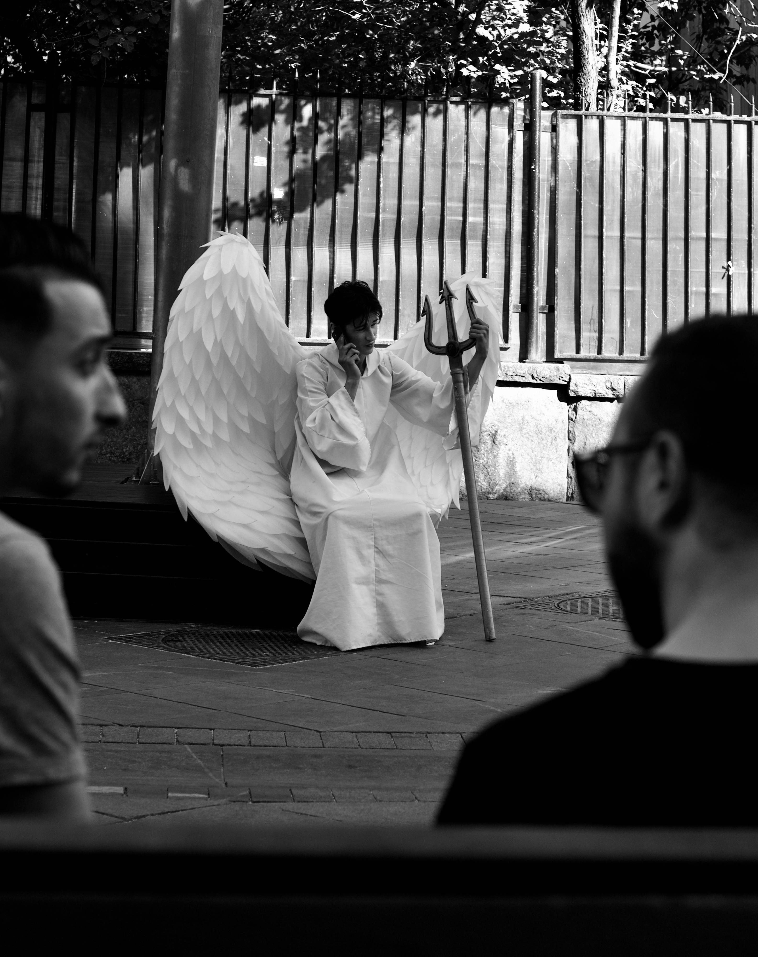 Angel Sitting with Trident · Free Stock Photo