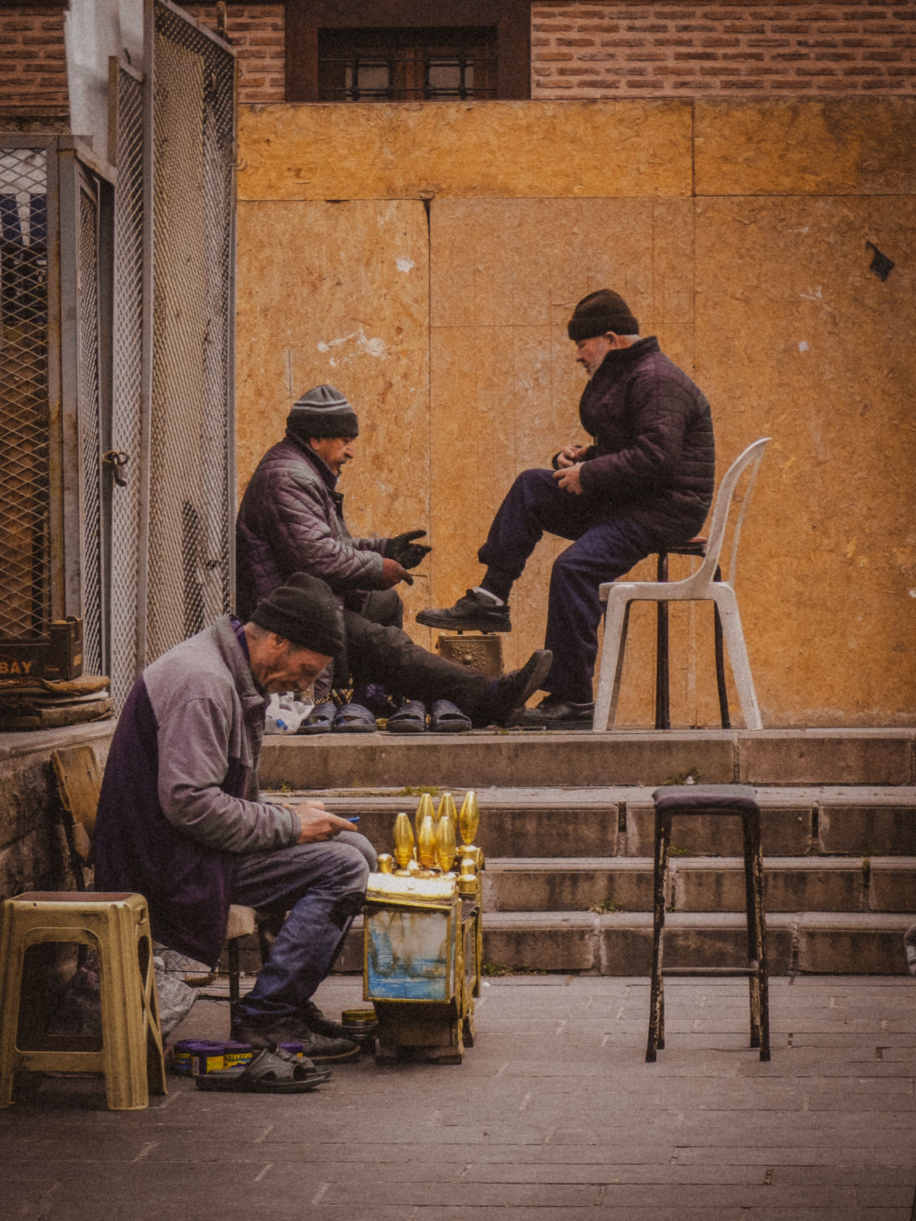 Men Sitting on Street · Free Stock Photo