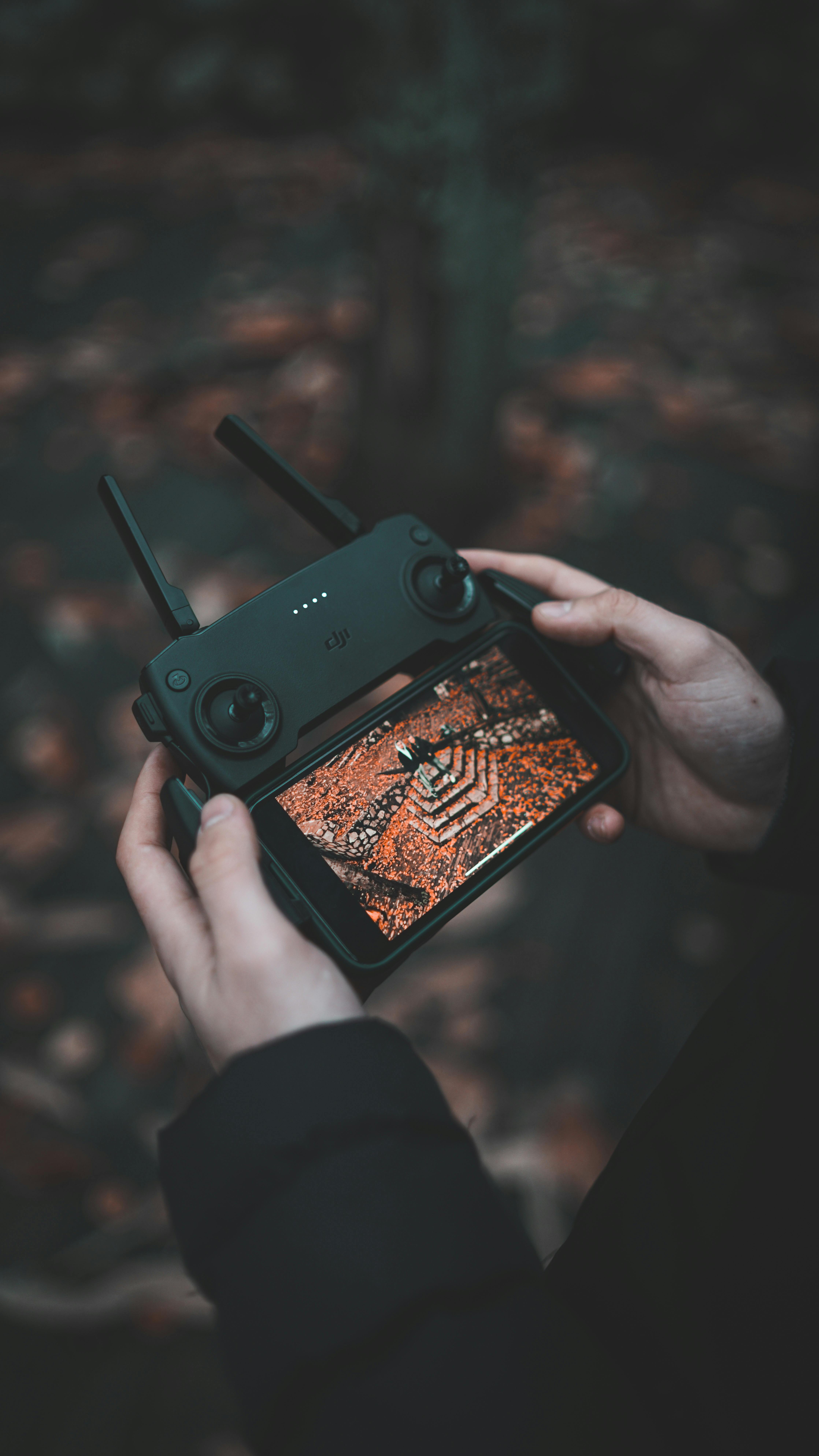 Man Holding Drone and Its Controller · Free Stock Photo