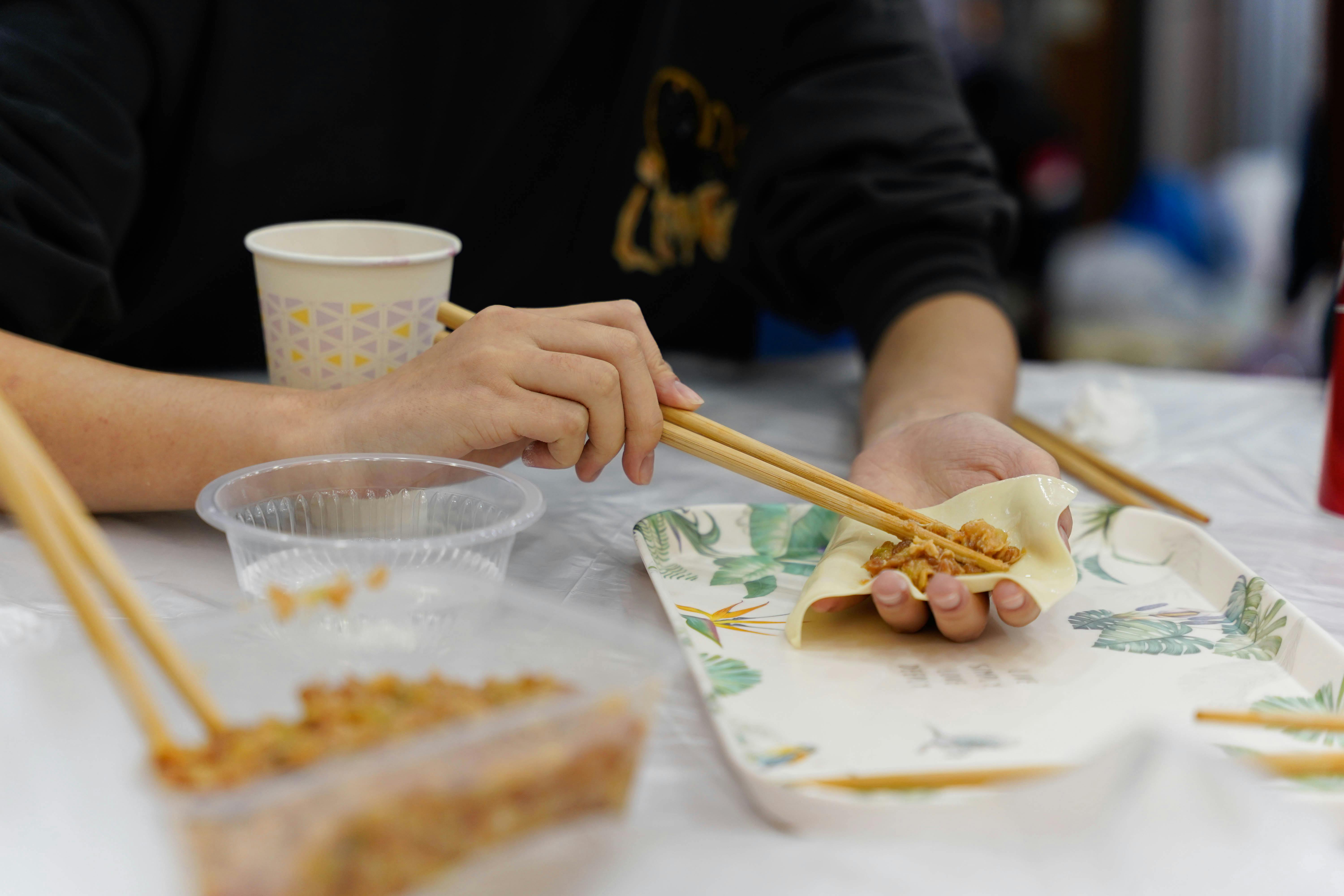 Woman Eating with Chopsticks · Free Stock Photo