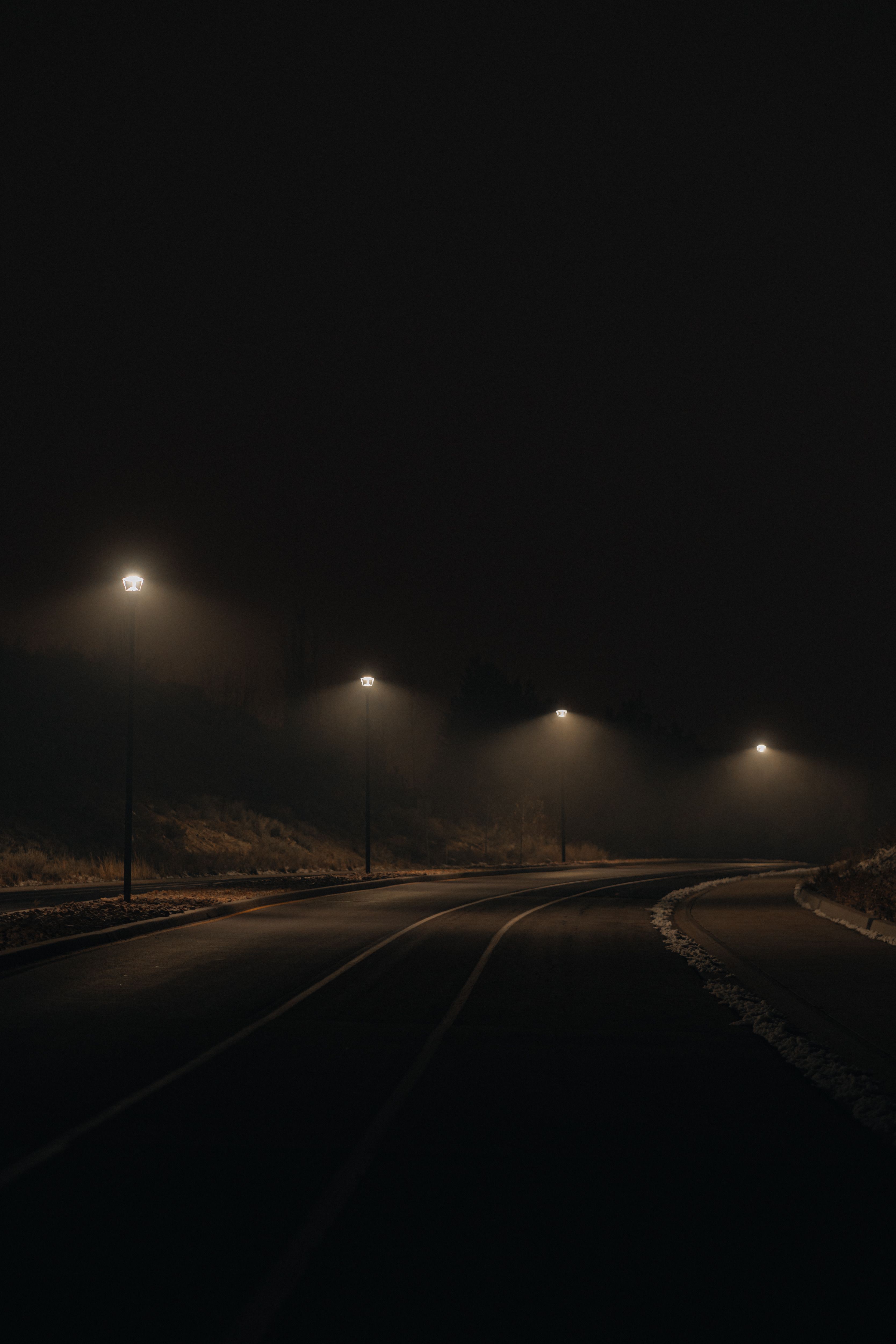 Illuminated Road at Night · Free Stock Photo
