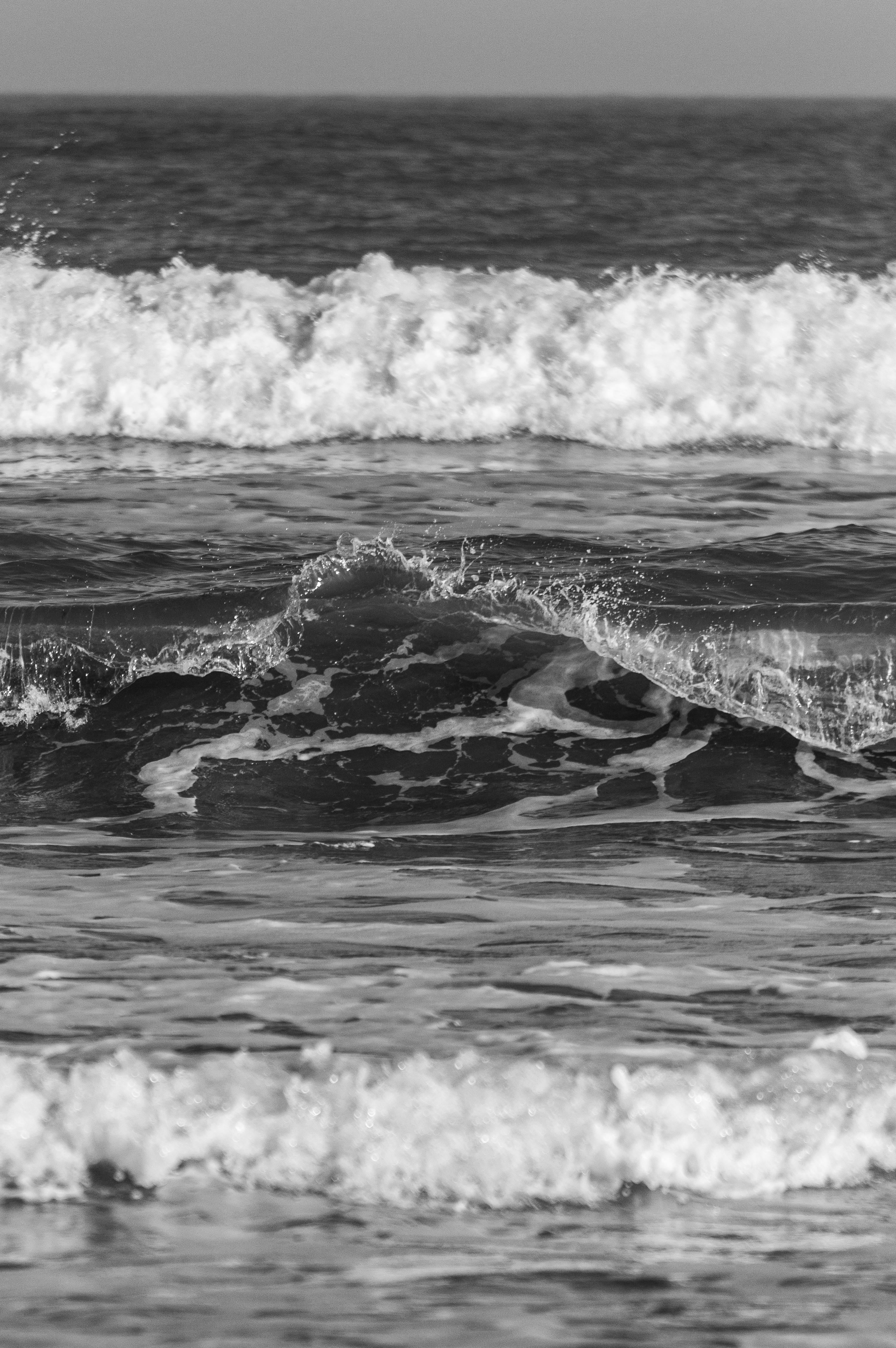 Grayscale Photo of Ocean Waves · Free Stock Photo