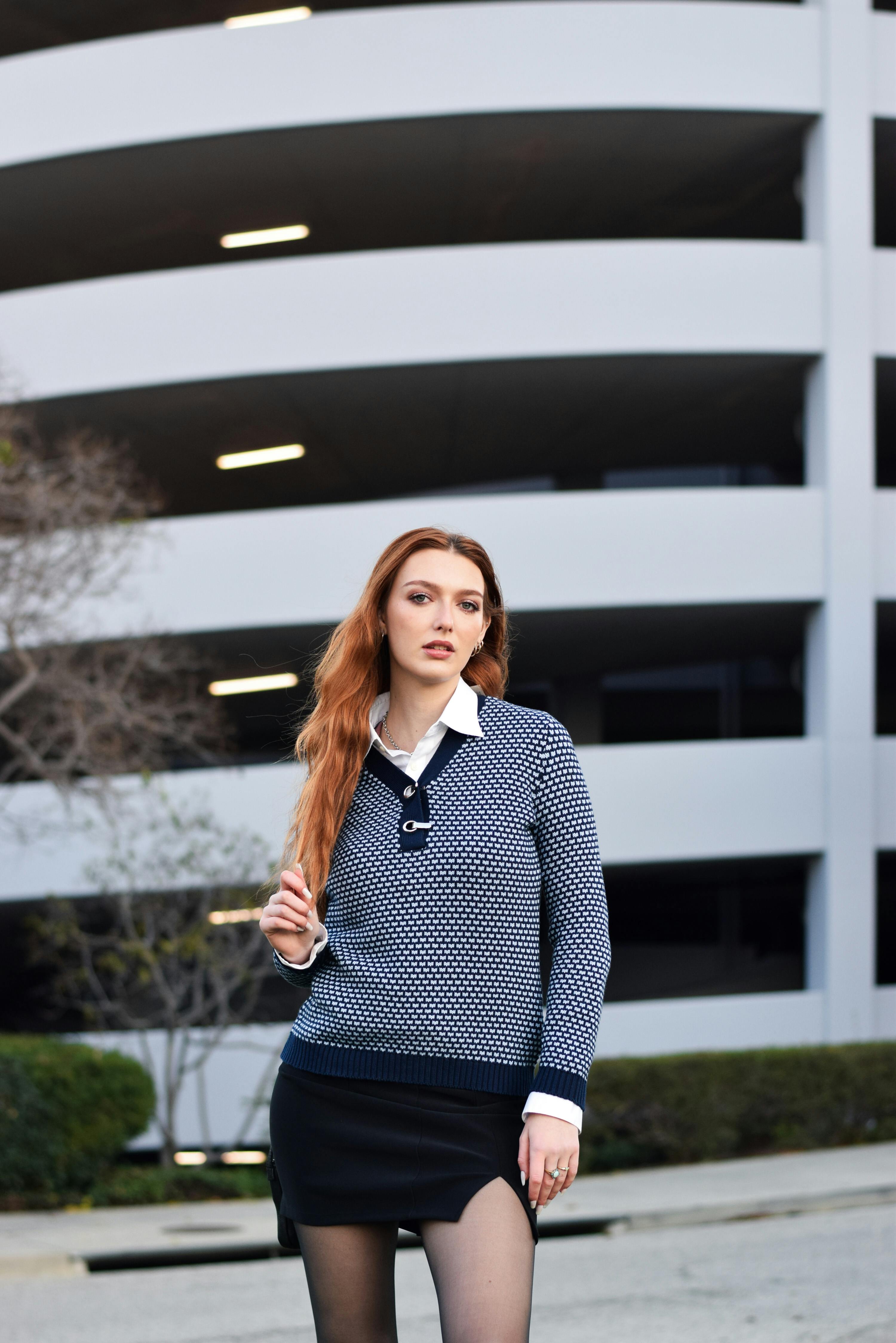 A Woman Modeling a Trendy Black Outfit in the Street · Free Stock Photo
