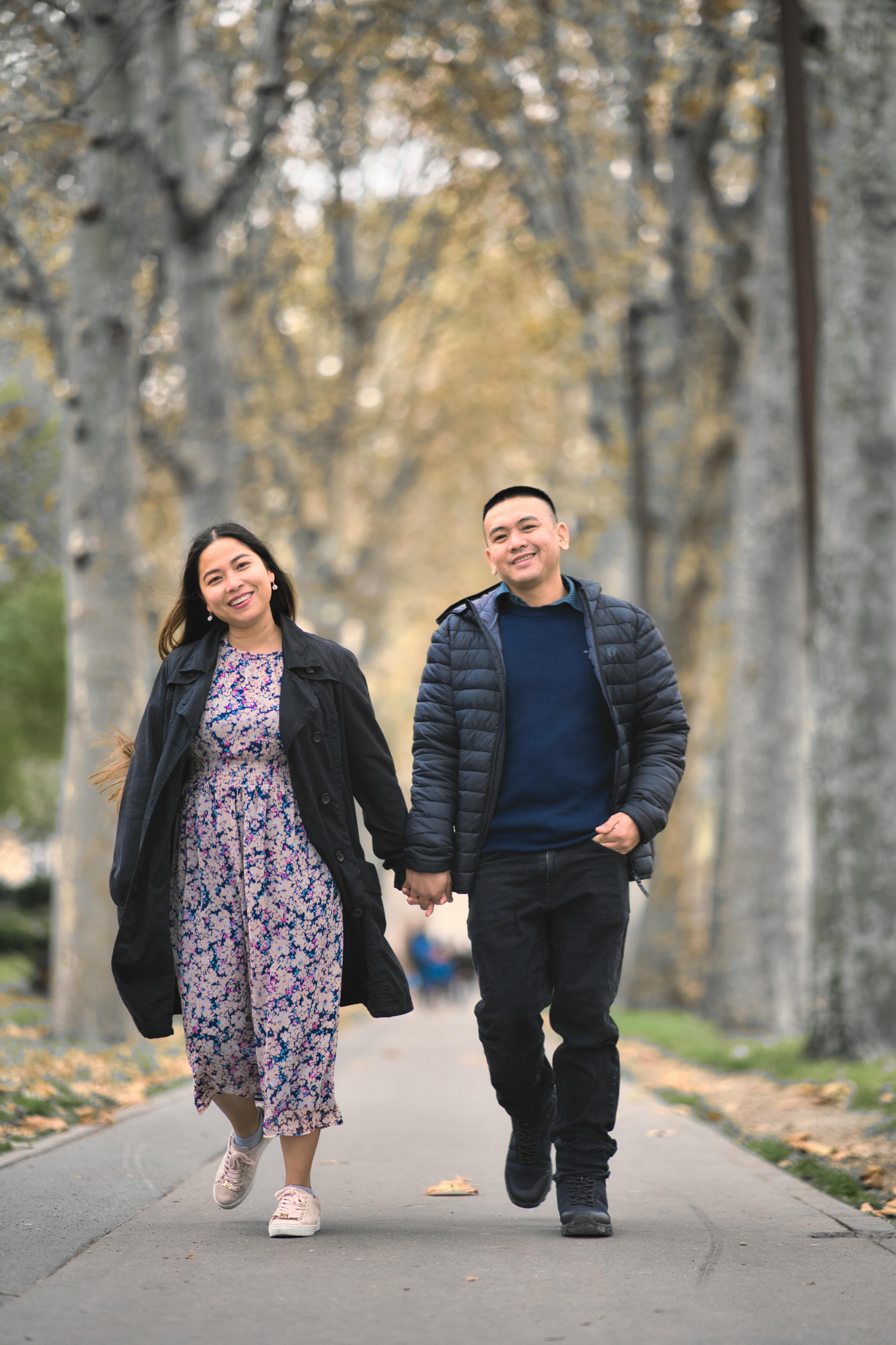 Couple Holding Hands While Walking · Free Stock Photo