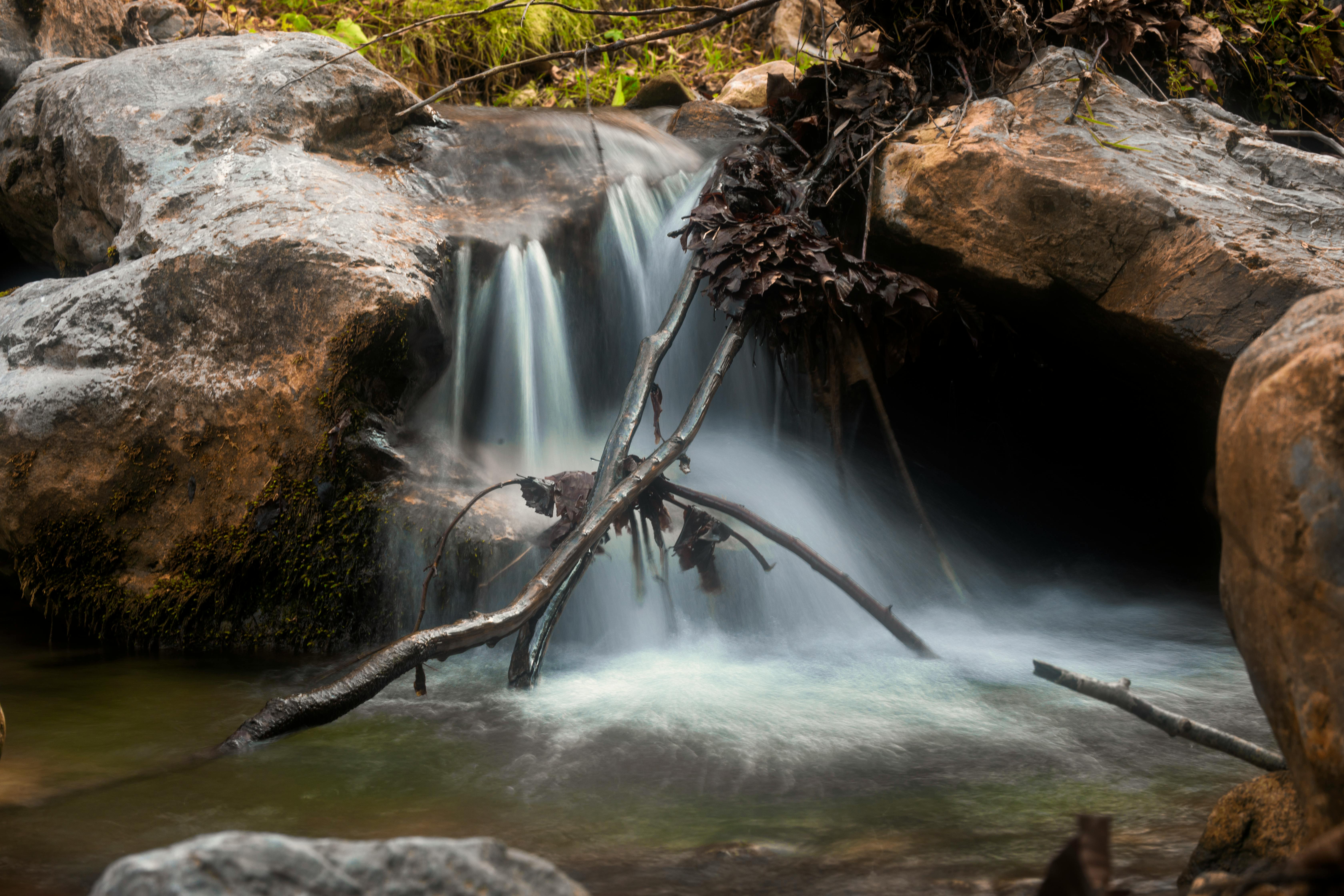 Close up of Waterfall Water Flowing over Rocks · Free Stock Photo