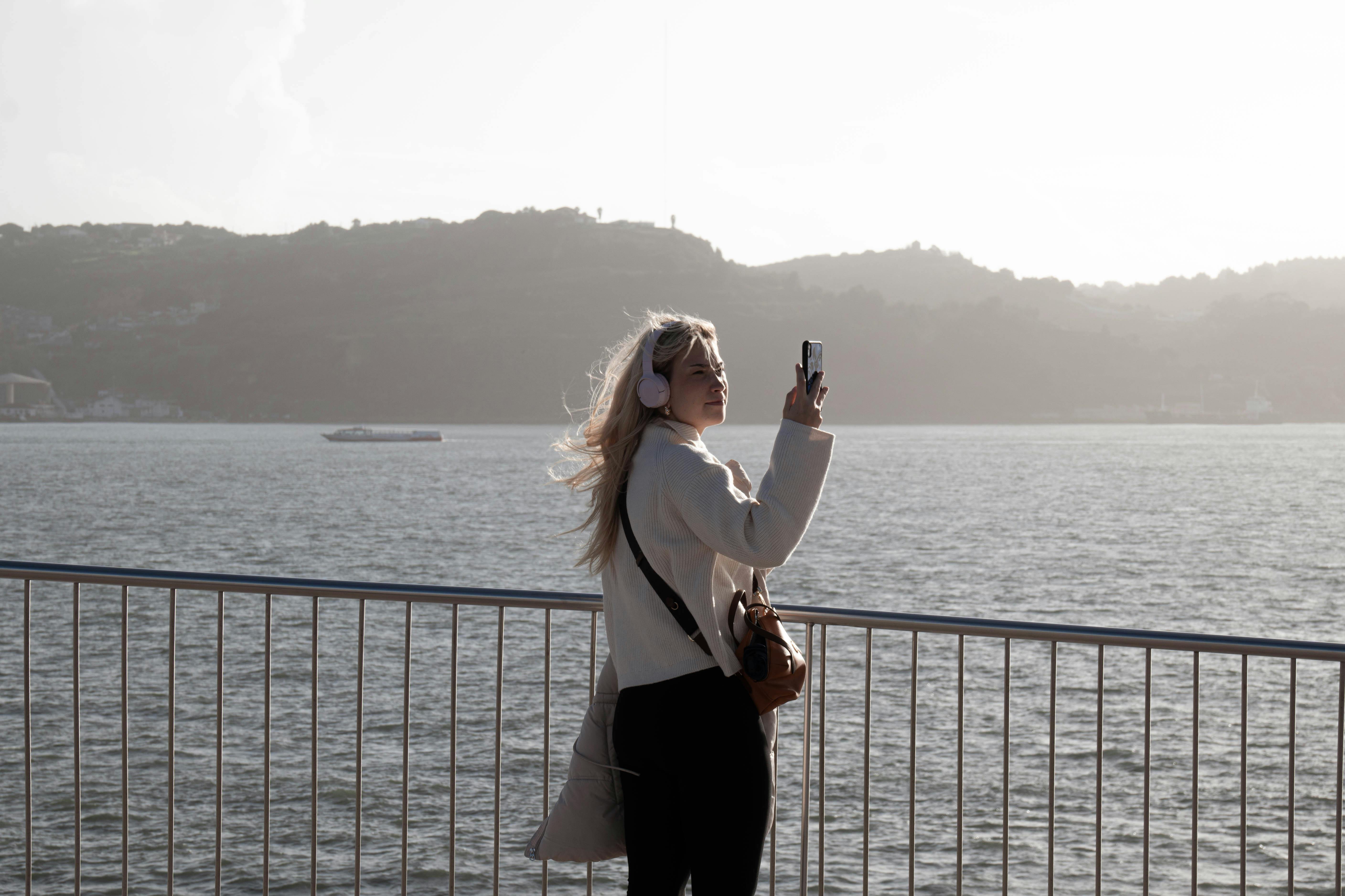 A Woman Standing on the Seaside · Free Stock Photo