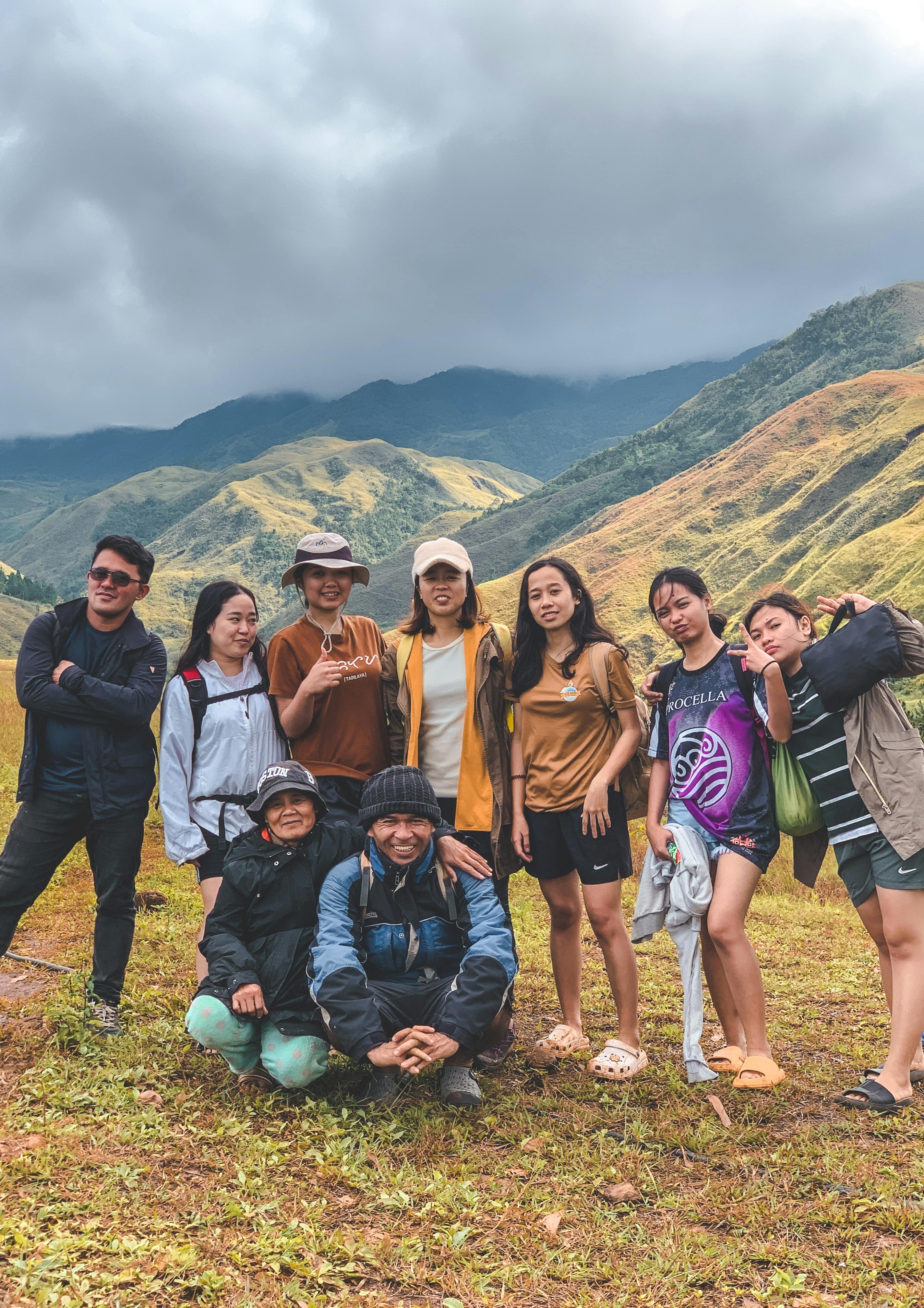 Young Group of People Posing for a Picture in Mountains · Free Stock Photo