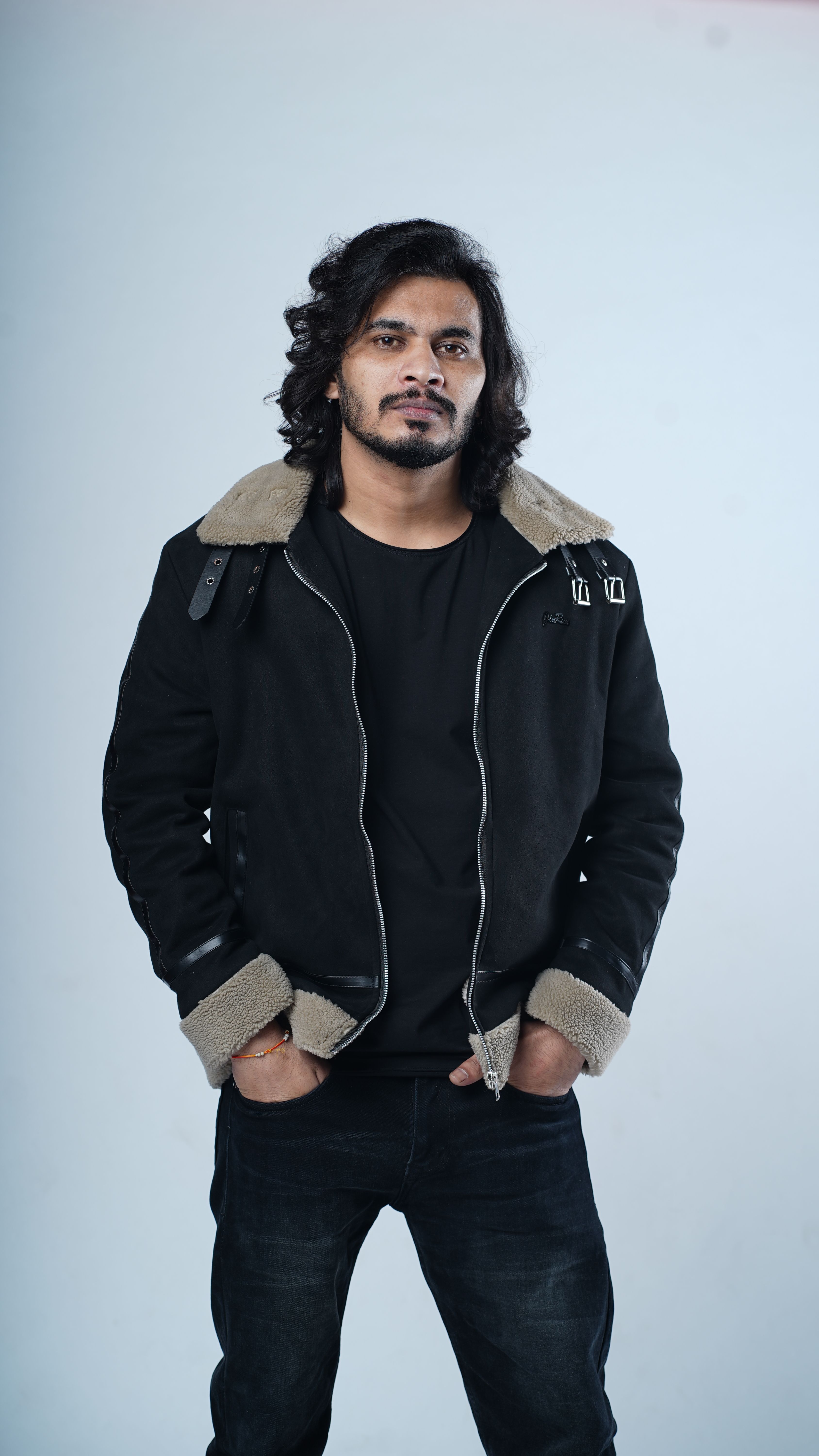 A Man in Black Jacket with His Hands on His Pockets · Free Stock Photo