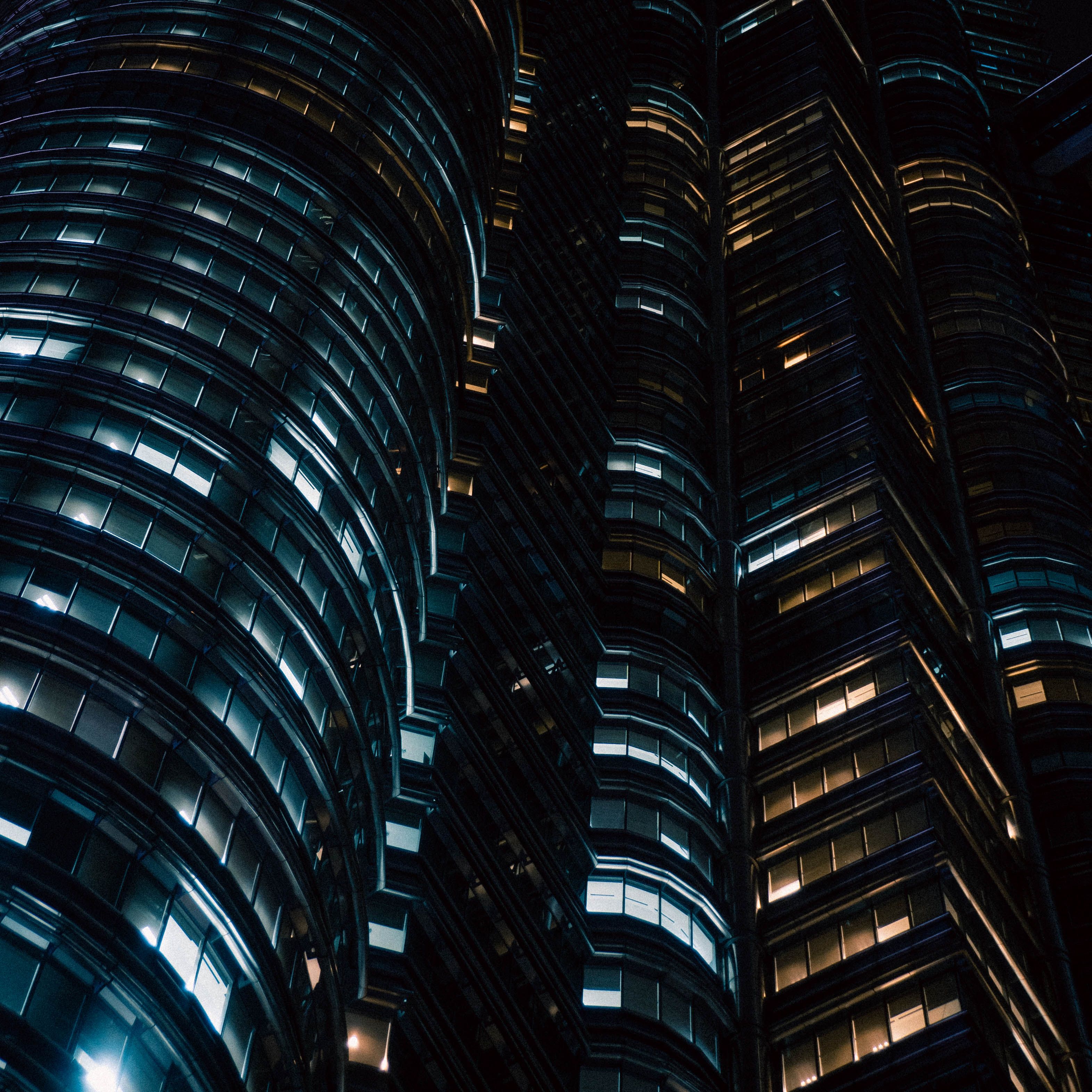 Illuminated Skyscrapers against Dark Night Sky · Free Stock Photo